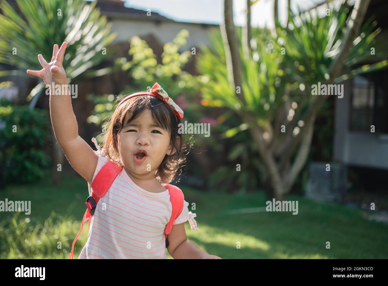 happy asian preschoolers toddler student raise her arm Stock Photo - Alamy