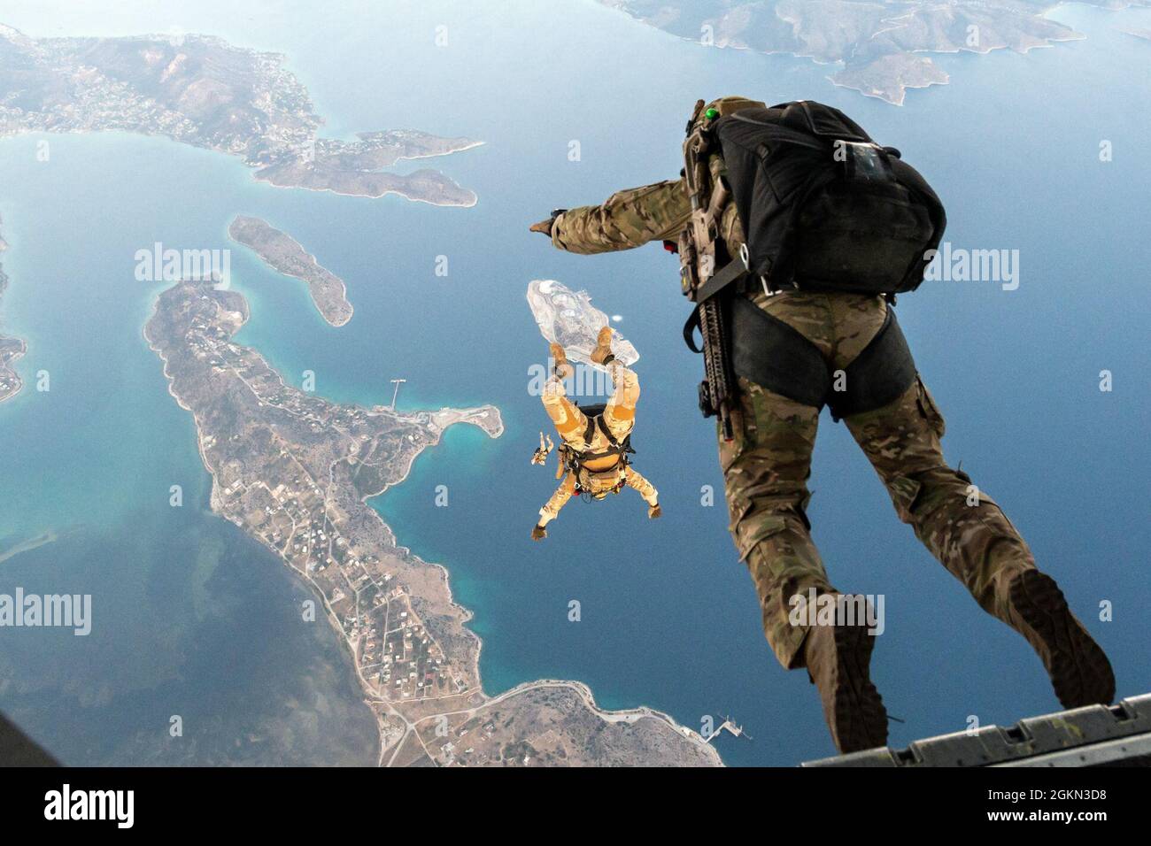 Greek Special Operations Forces execute a multinational military free fall from a U.S. Air Force ...