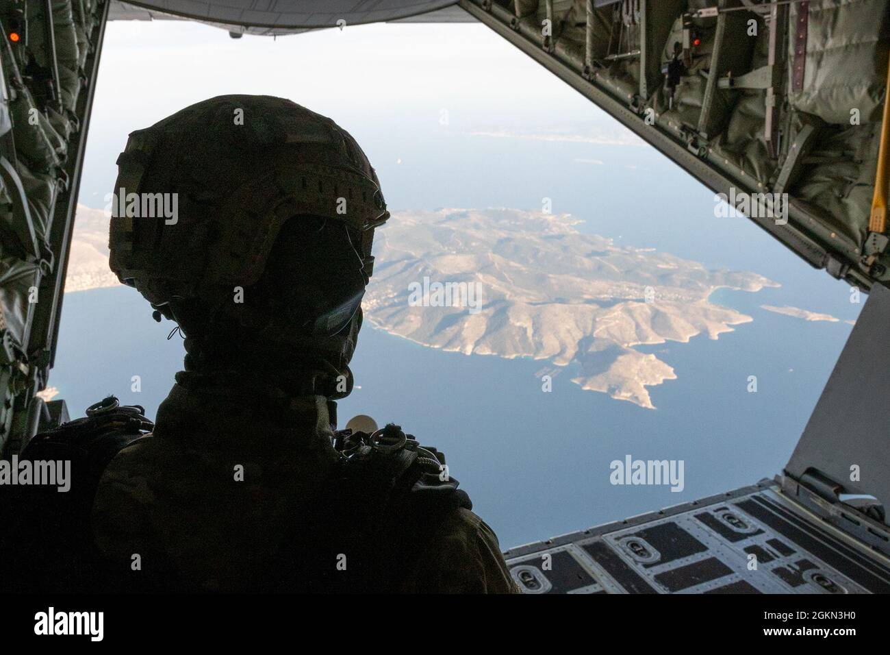 A Greek Special Forces jumpmaster prepares teammates for a ...