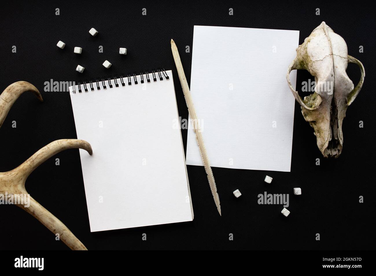 White notebook mockup template on black background with magical ...