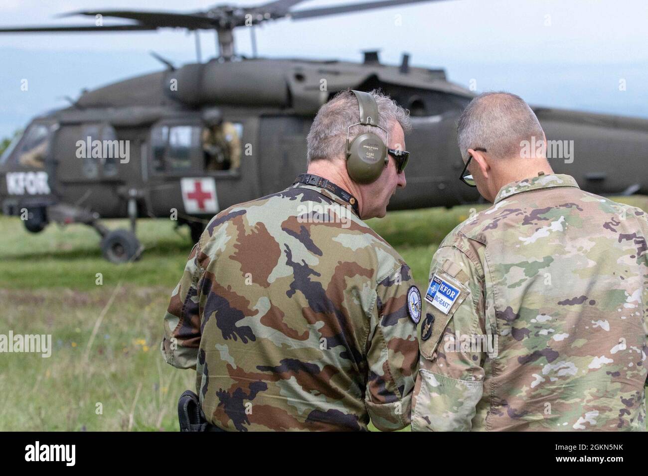 Members with the Joint Implementation Commission, Kosovo Force watch as ...