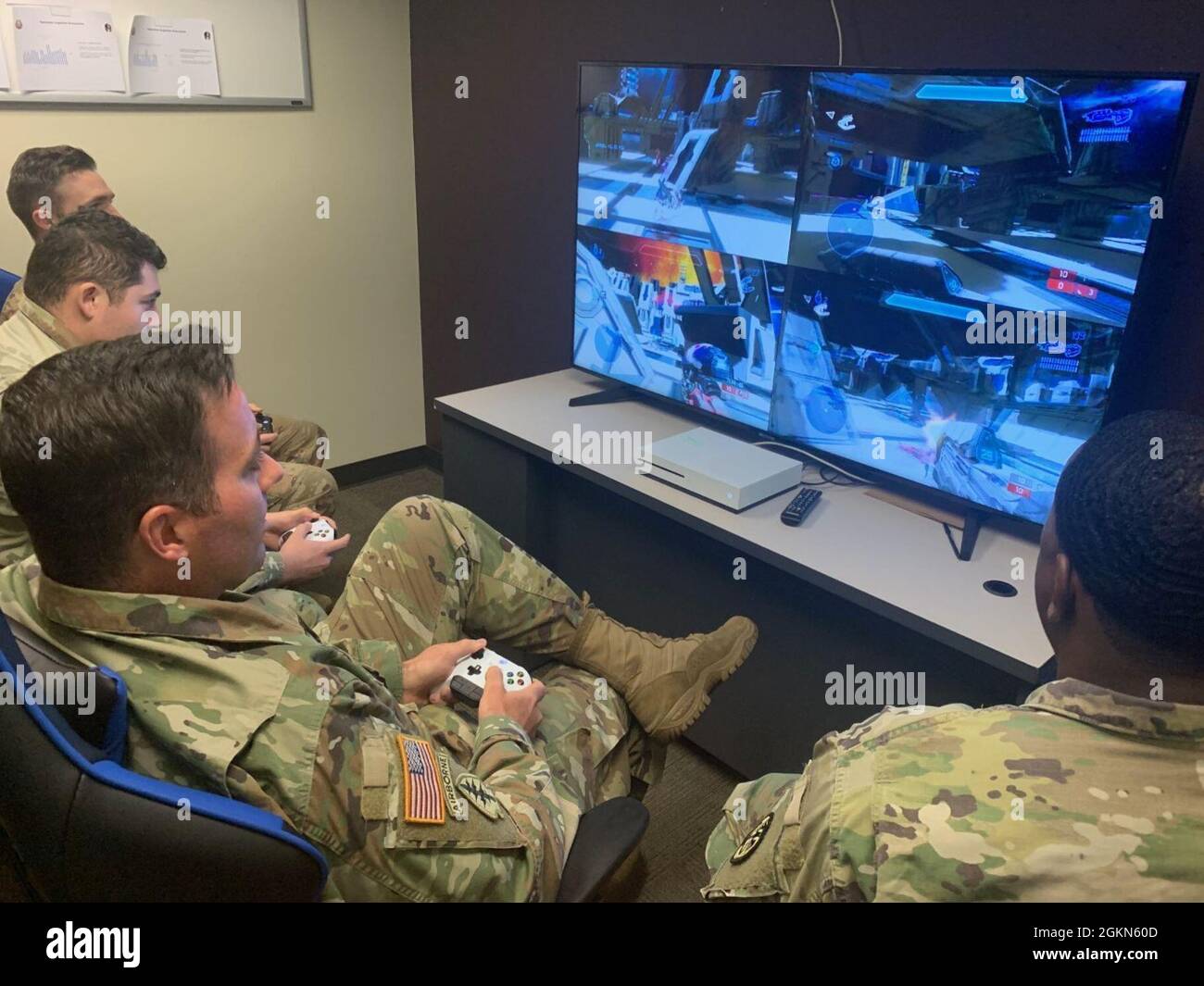 Soldiers play a video game together at the Soldier Recovery Unit in ...