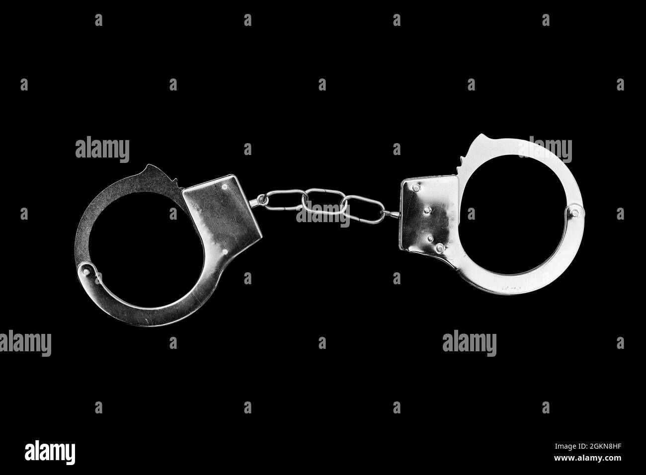 handcuffs isolated on a black background. High quality photo Stock ...