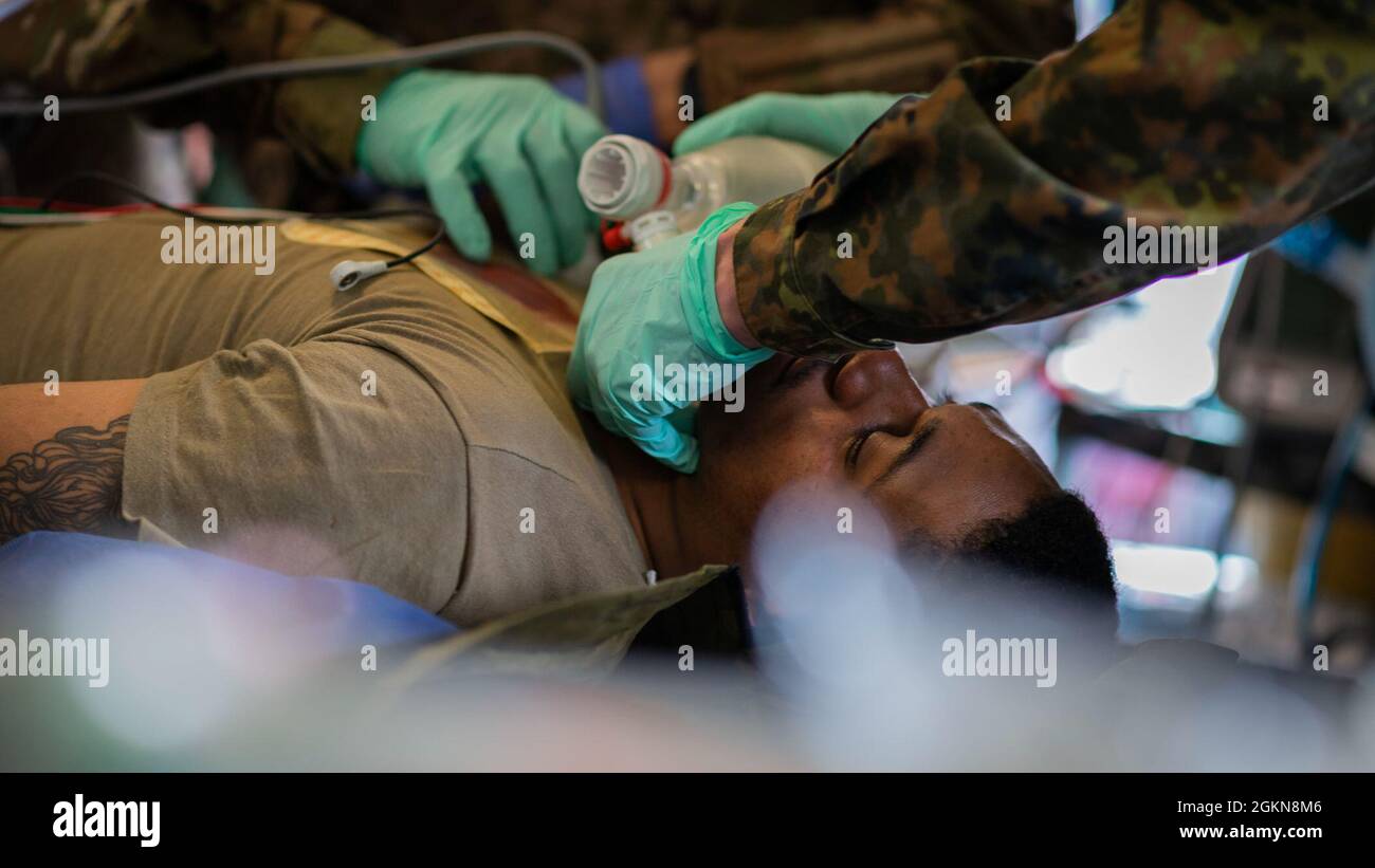 U.S. Army Soldiers with 512th Field Hospital treat a simulated casualty ...