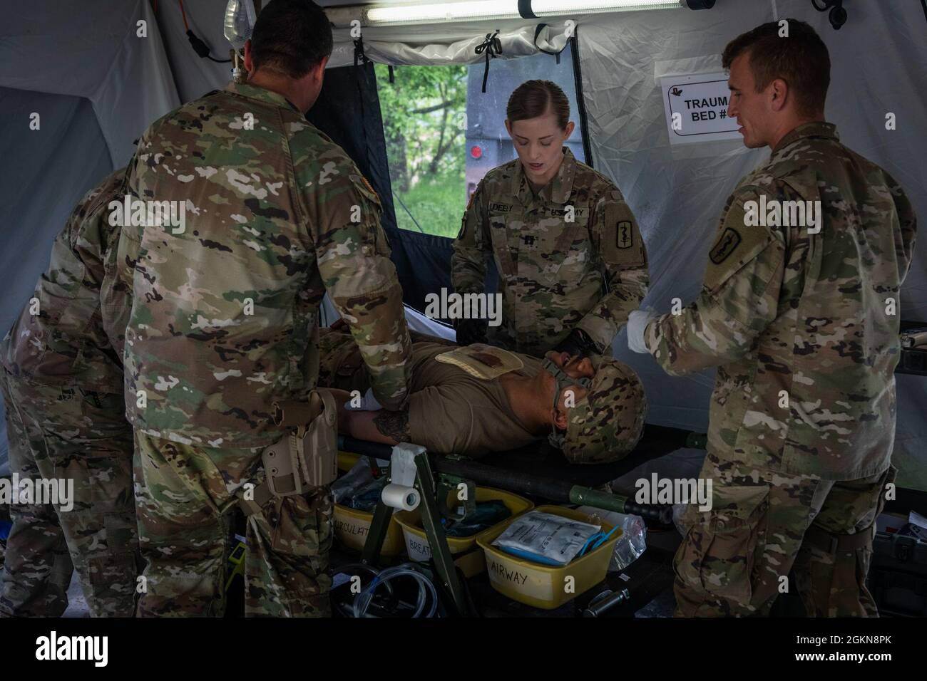 U.S. Army Soldiers with 557th Medical Company Area Support treat a ...