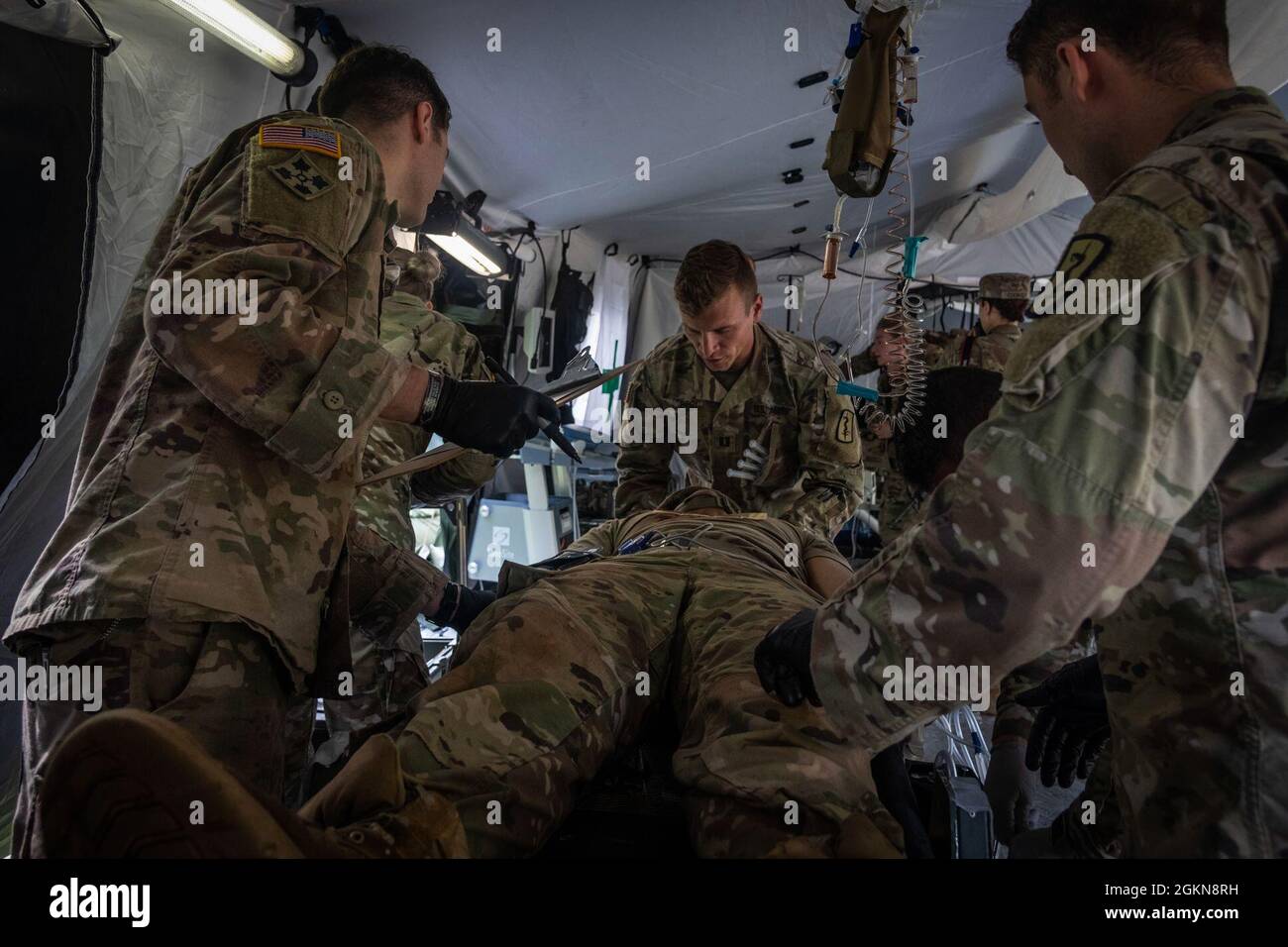 U.S. Army Soldiers with 557th Medical Company Area Support treat a ...
