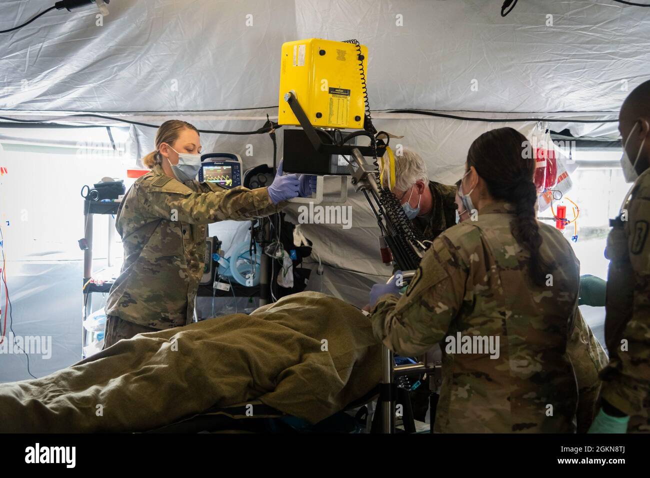 U.S. Soldiers with 30th Medical Brigade and NATO partners treat a ...
