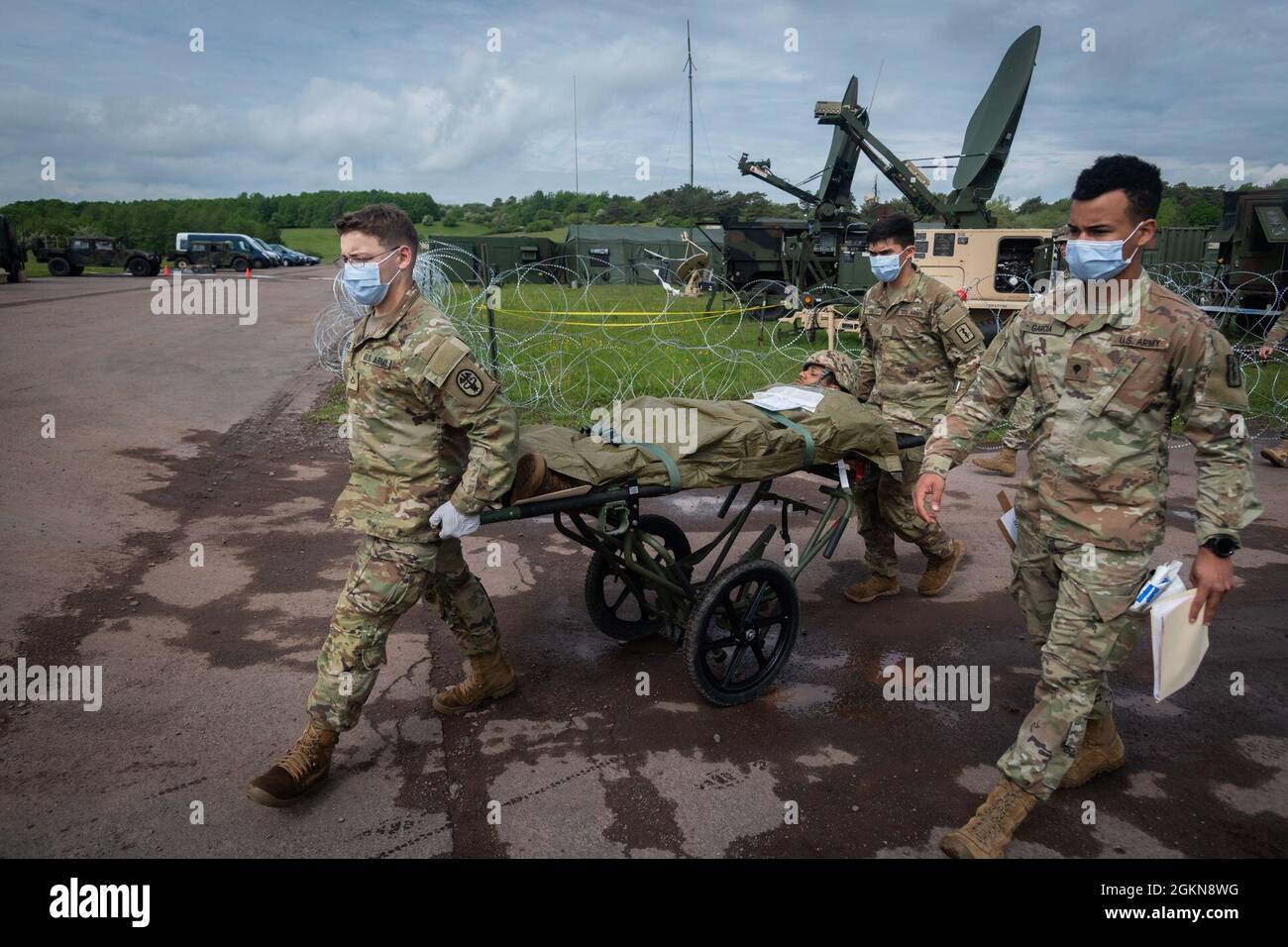 U.S. Soldiers with 30th Medical Brigade transport a K9 "Diesel" dog ...