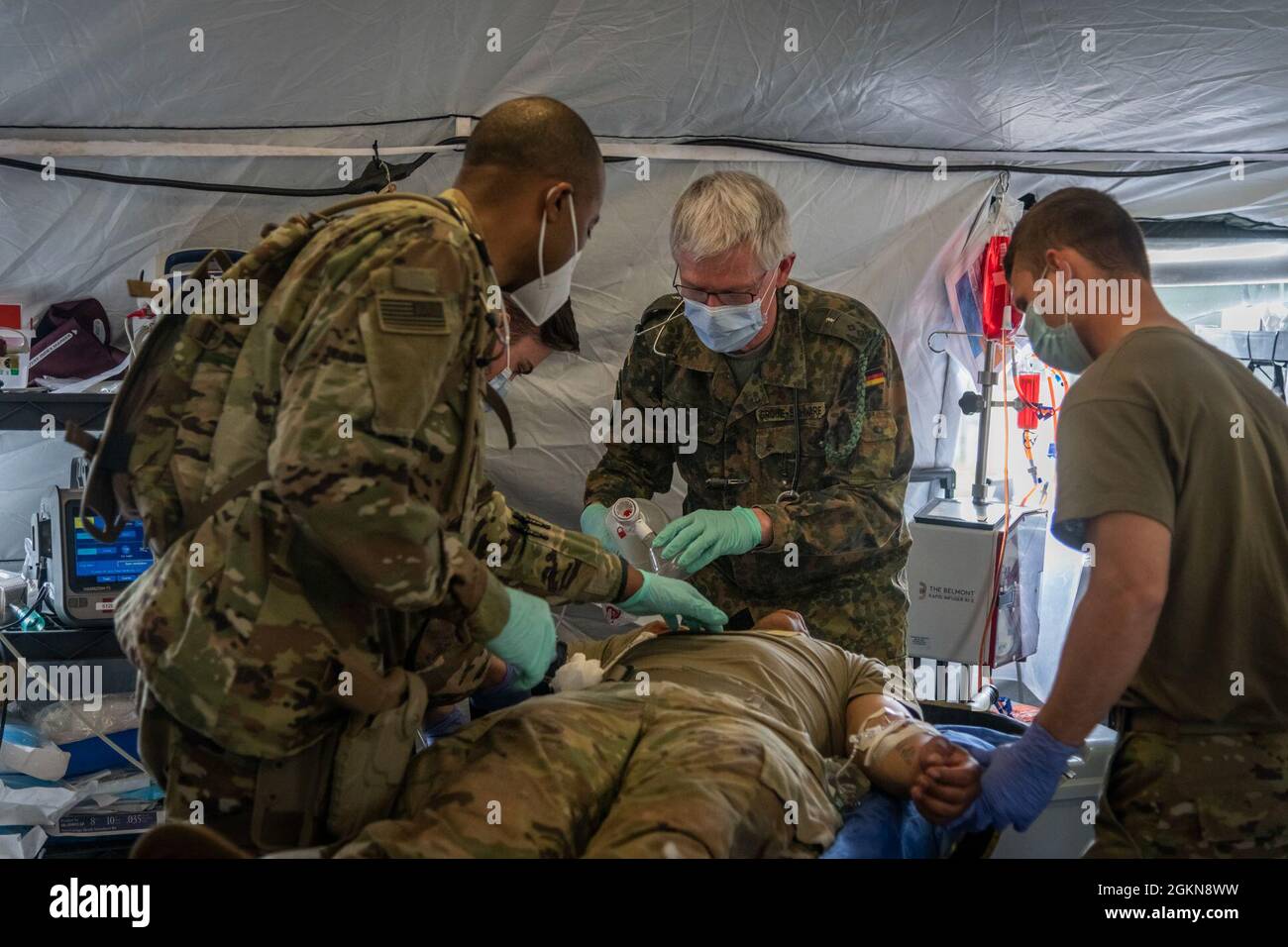 U.S. Soldiers with 30th Medical Brigade and NATO partners treat a ...