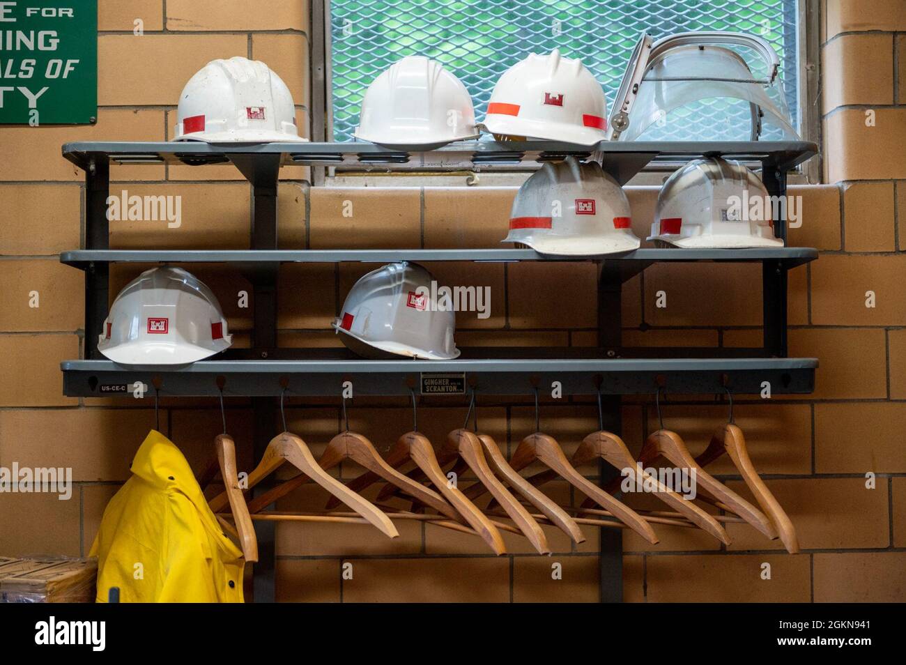 A rack of construction helmets is laid out during a safety inspection ...