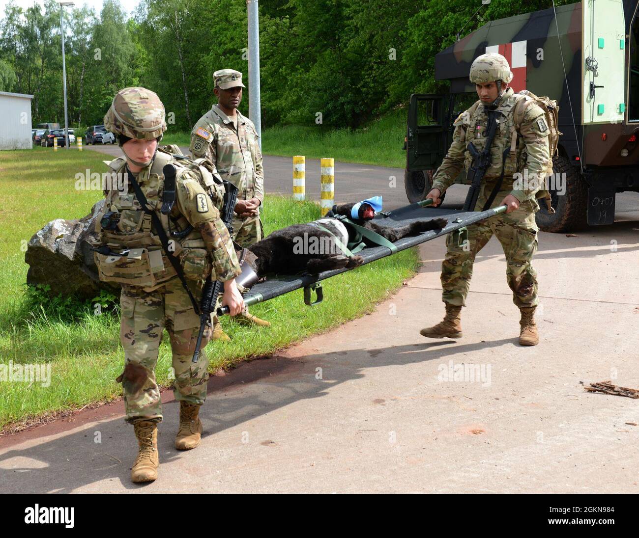 U.S. Soldiers with 30th Medical Brigade transport a K9 “Diesel” dog ...