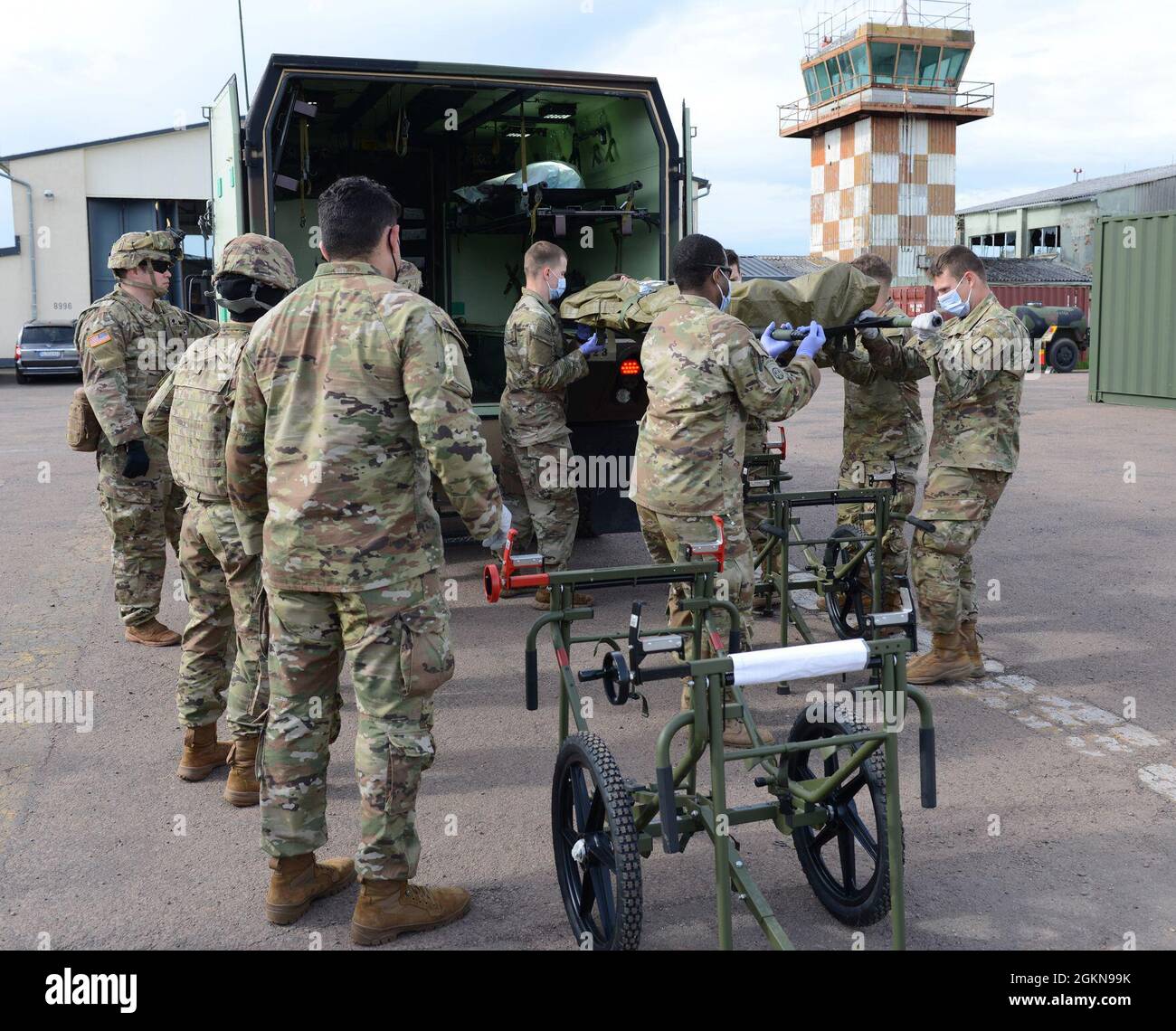 U.S. Soldiers with 30th Medical Brigade transport a simulated casualty ...