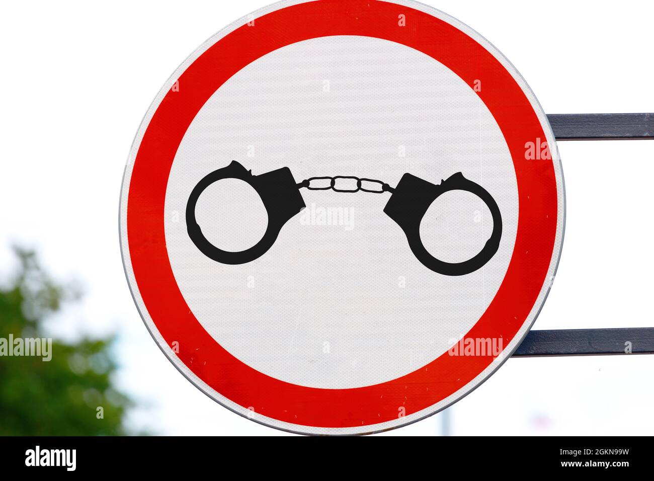 images of handcuffs on a road sign. road crime concept. High quality ...