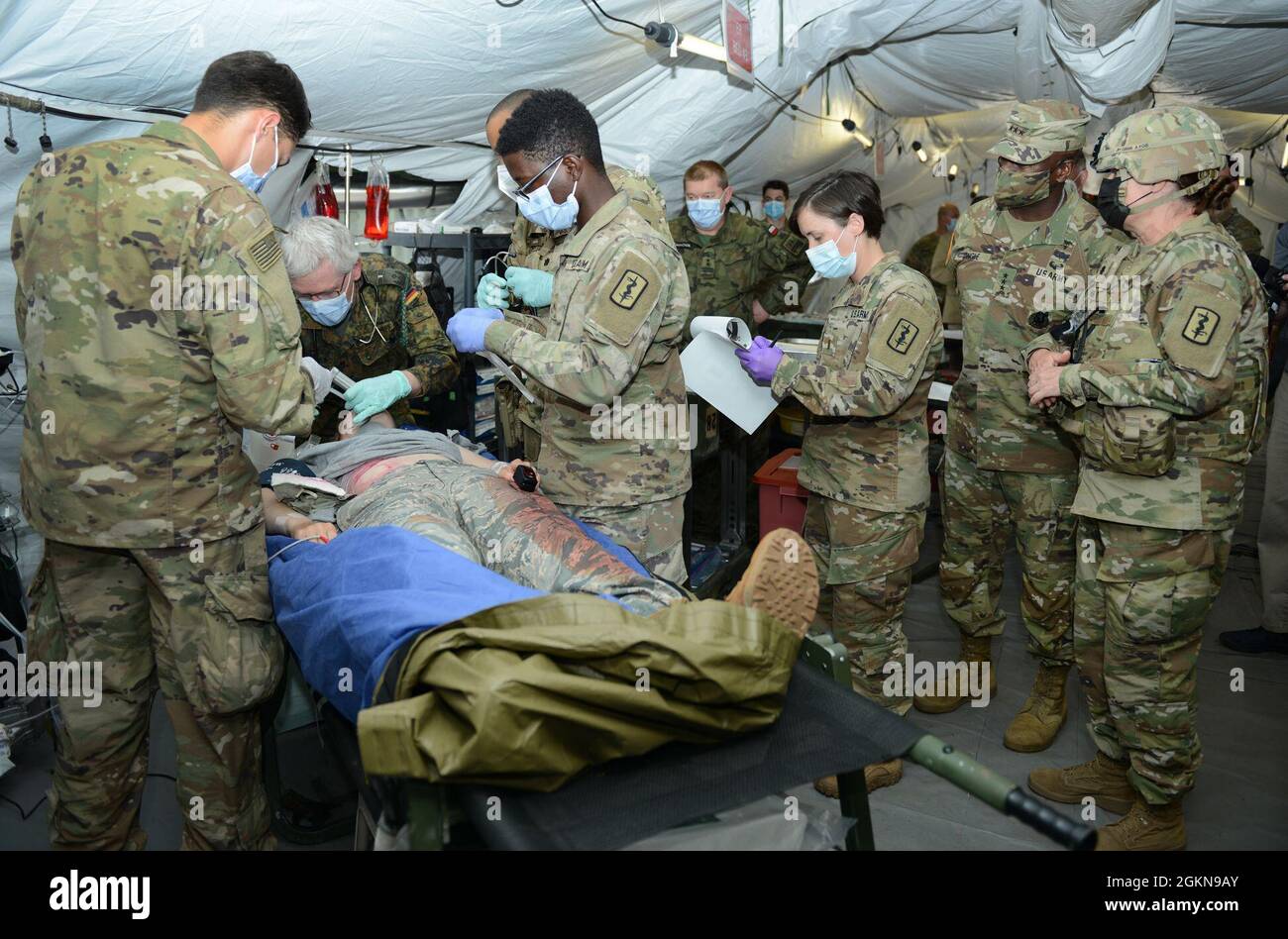 U.S. Soldiers with 30th Medical Brigade and NATO partners treat a ...