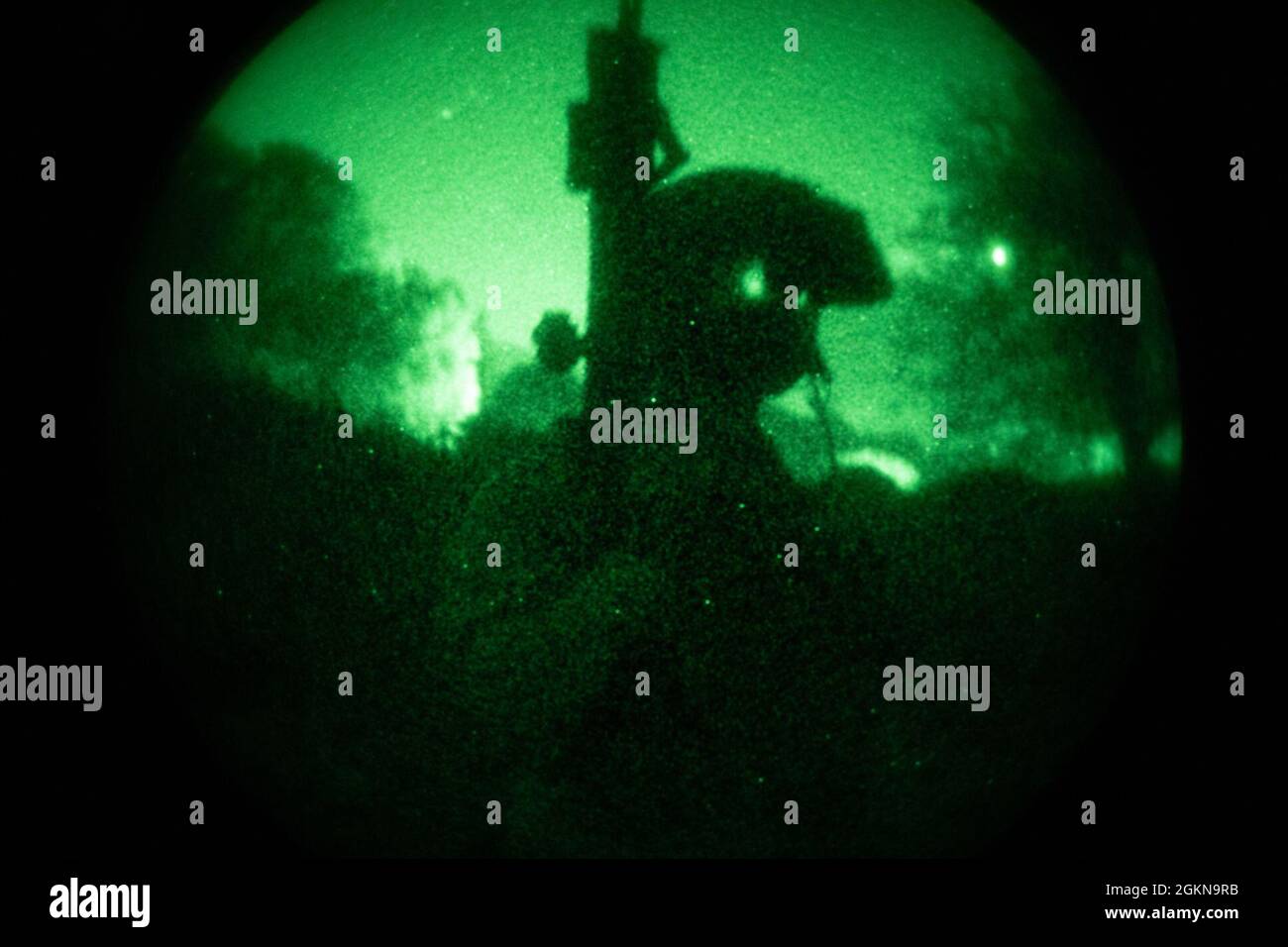A U.S. Navy SEAL conducts a nighttime patrol during an infiltration and ...