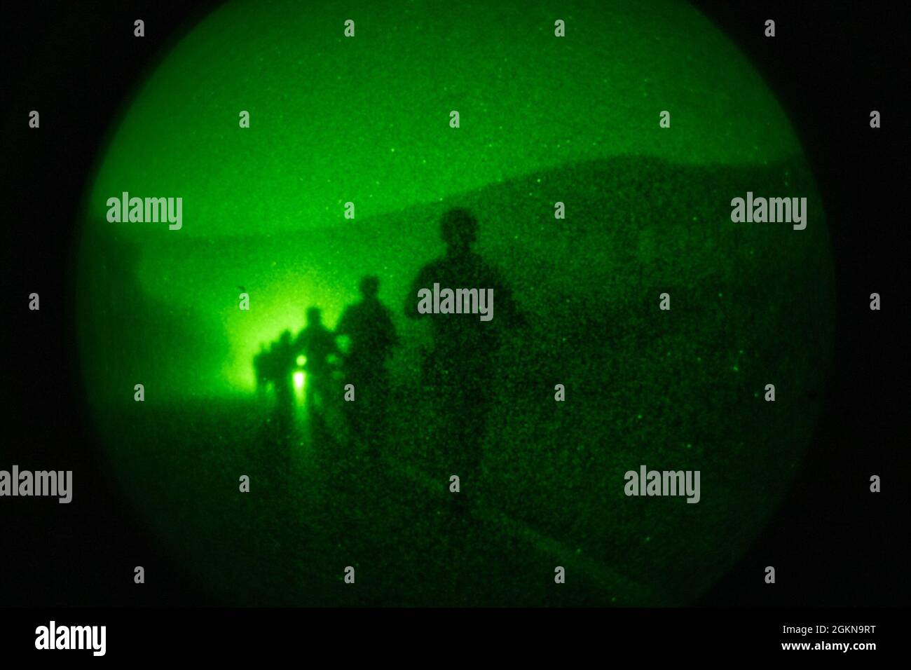 U.S. Navy SEALs conduct a nighttime patrol during an infiltration and ...