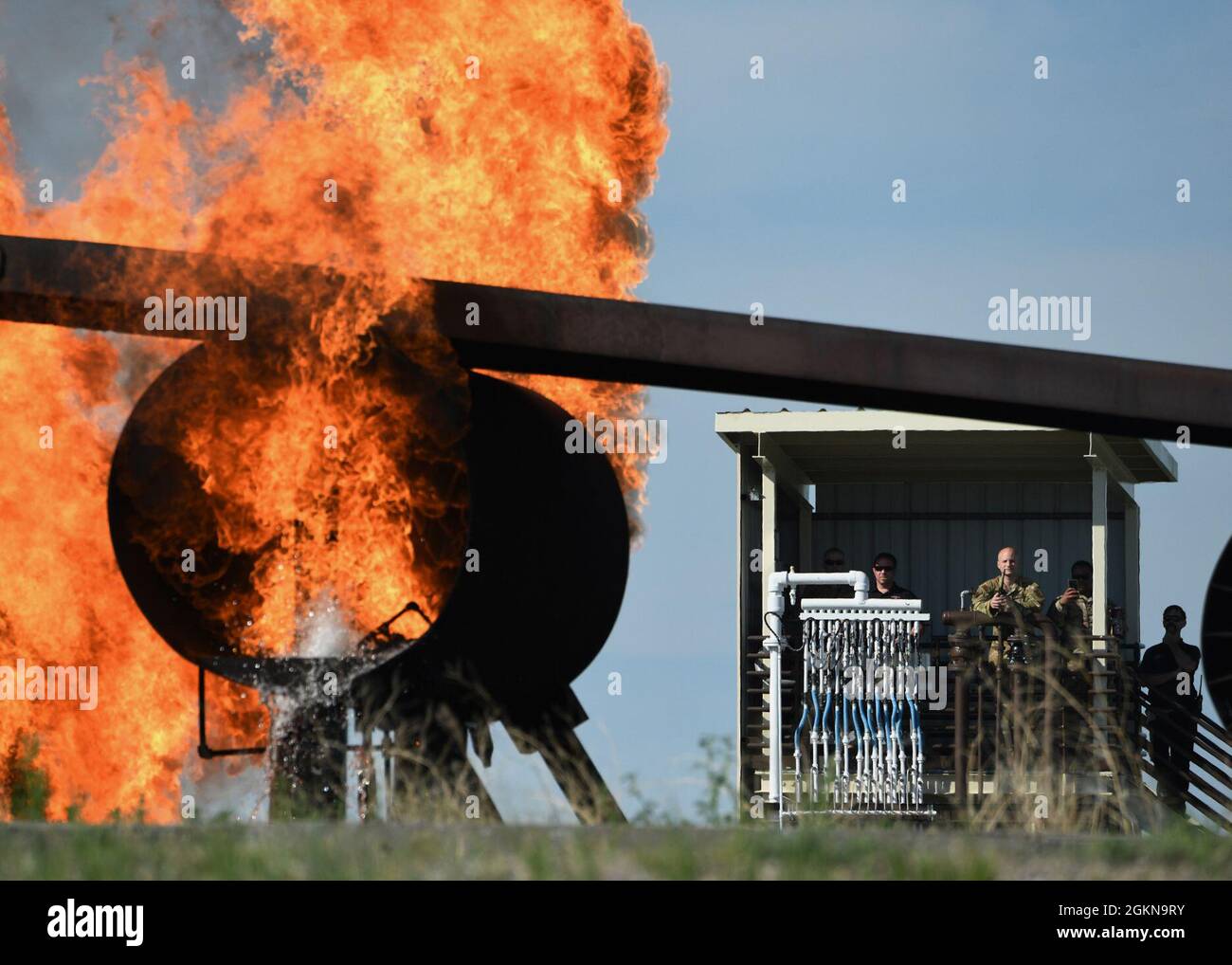 Members of the 341st Civil Engineer Squadron firefighters control the ...