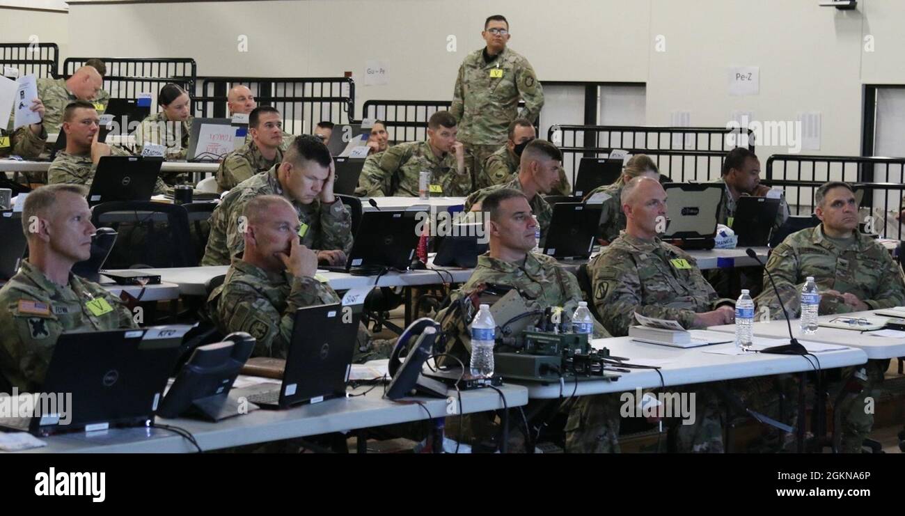 Members of the 29th Infantry Division command team listen in on a ...