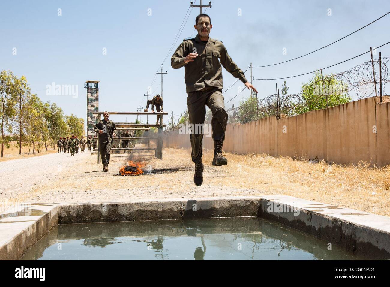 Newly recruited trainees to the Kurdish Security Forces conduct an ...