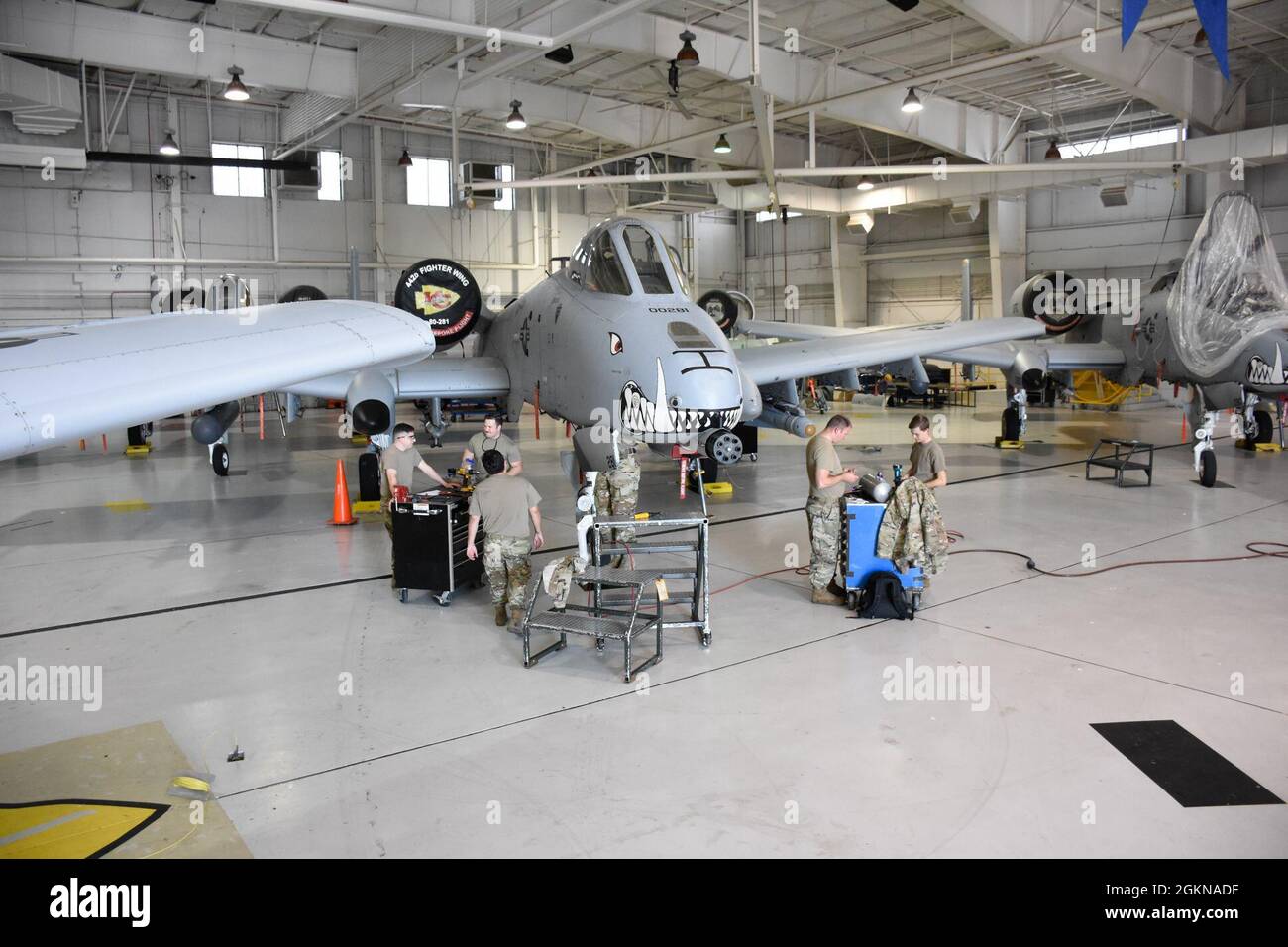 Airmen assigned to the 442d Maintenance Group work together to complete ...