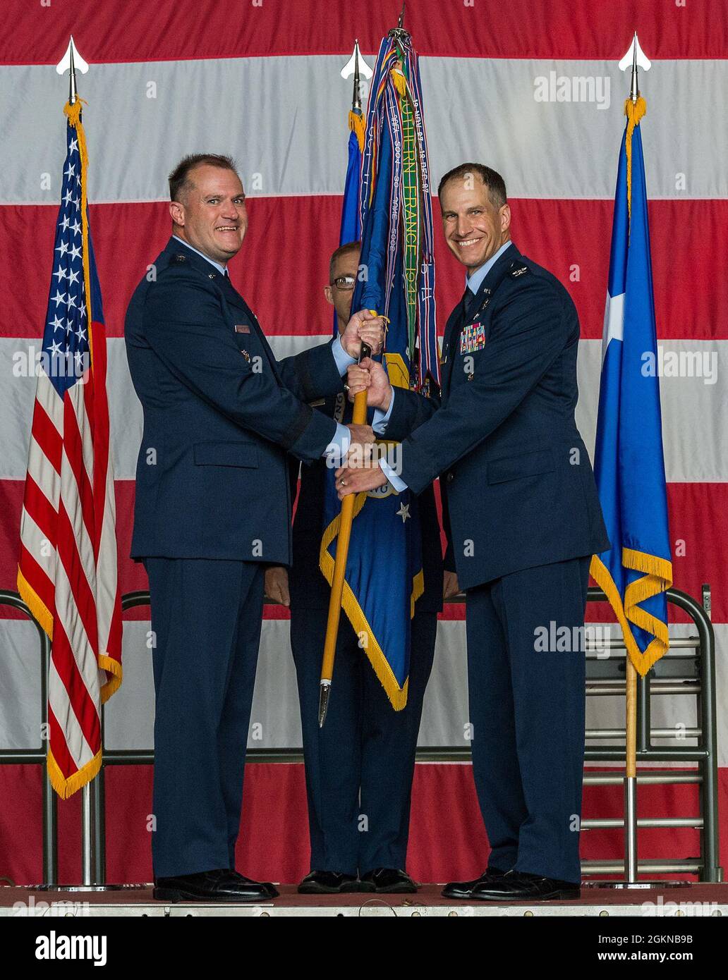 Maj. Gen. Thad Bibb, left, 18th Air Force commander, presents the 436th ...