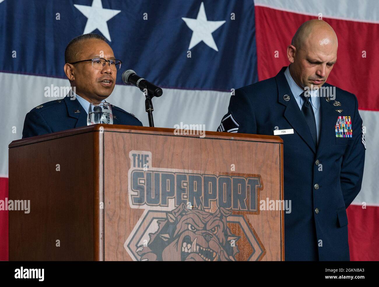 Lt. Col. Abner Valenzuela, left, 436th Airlift Wing chaplain, gives the ...