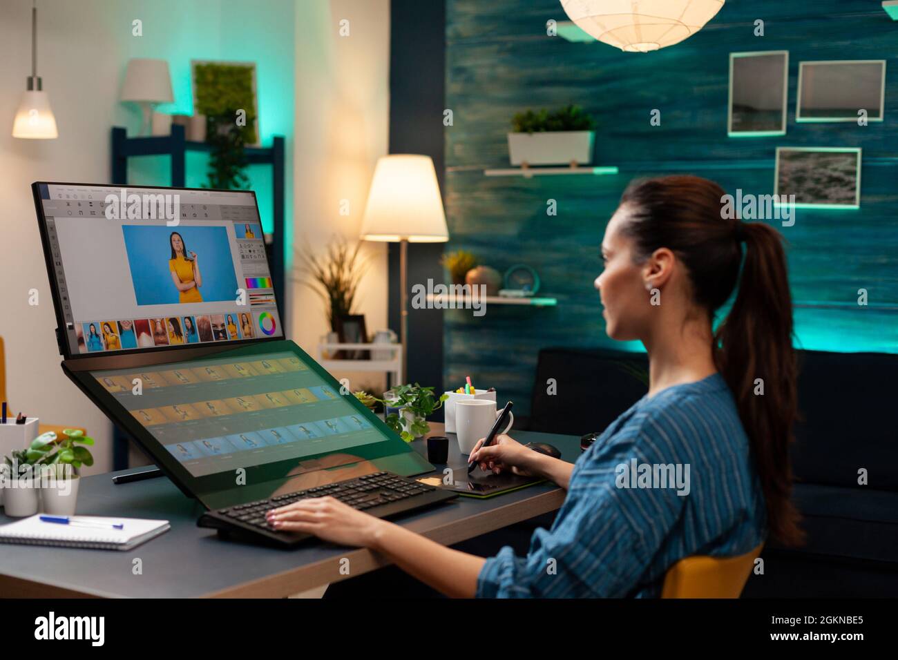 Retouch studio worker editing picture of model for photography agency ...