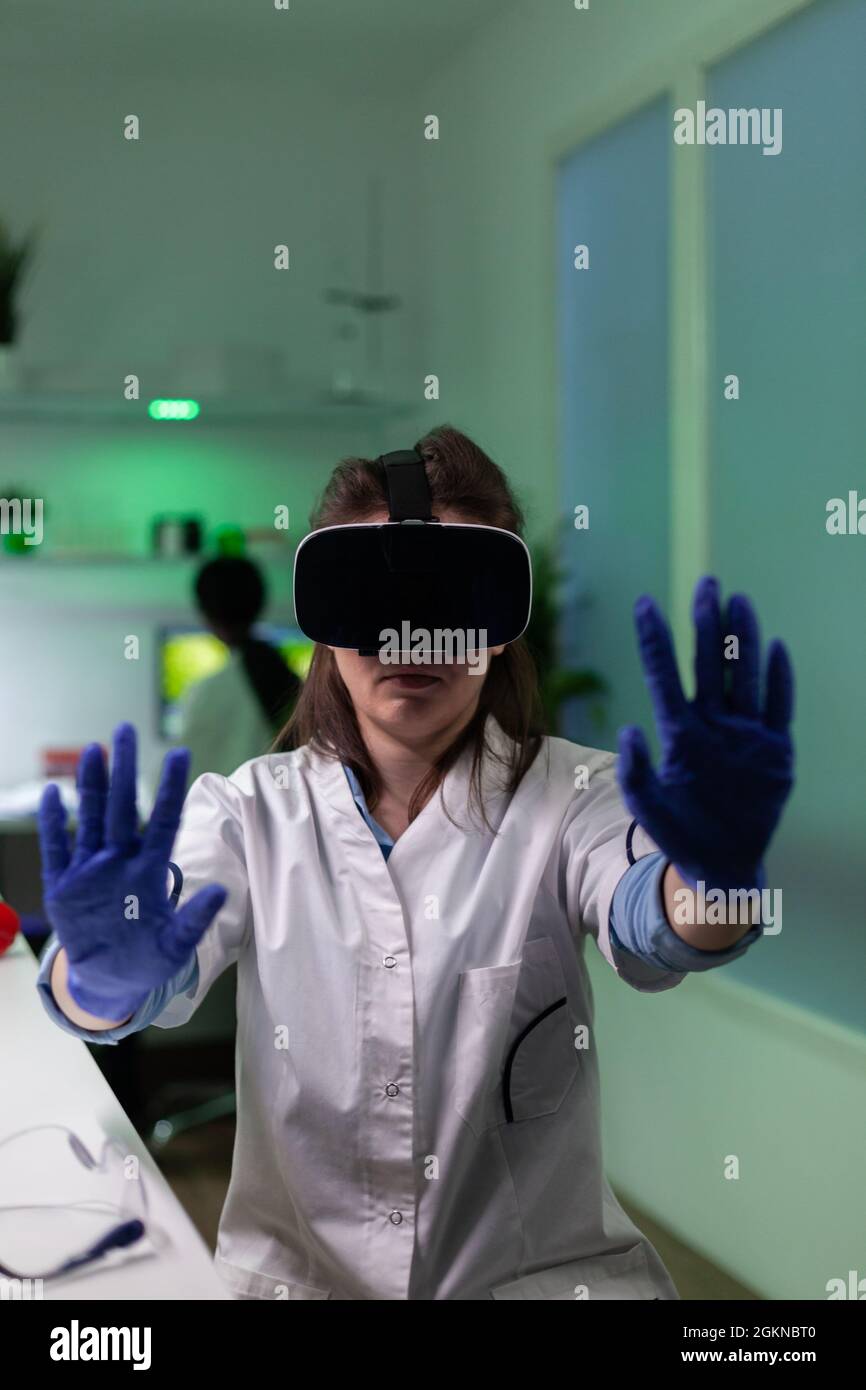 Portrait of chemist scientist doctor analyzing virtual gmo plants ...