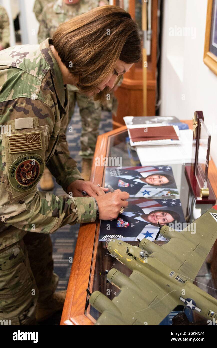 Chief Master Sergeant of the Air Force JoAnne S. Bass, signs copies of ...