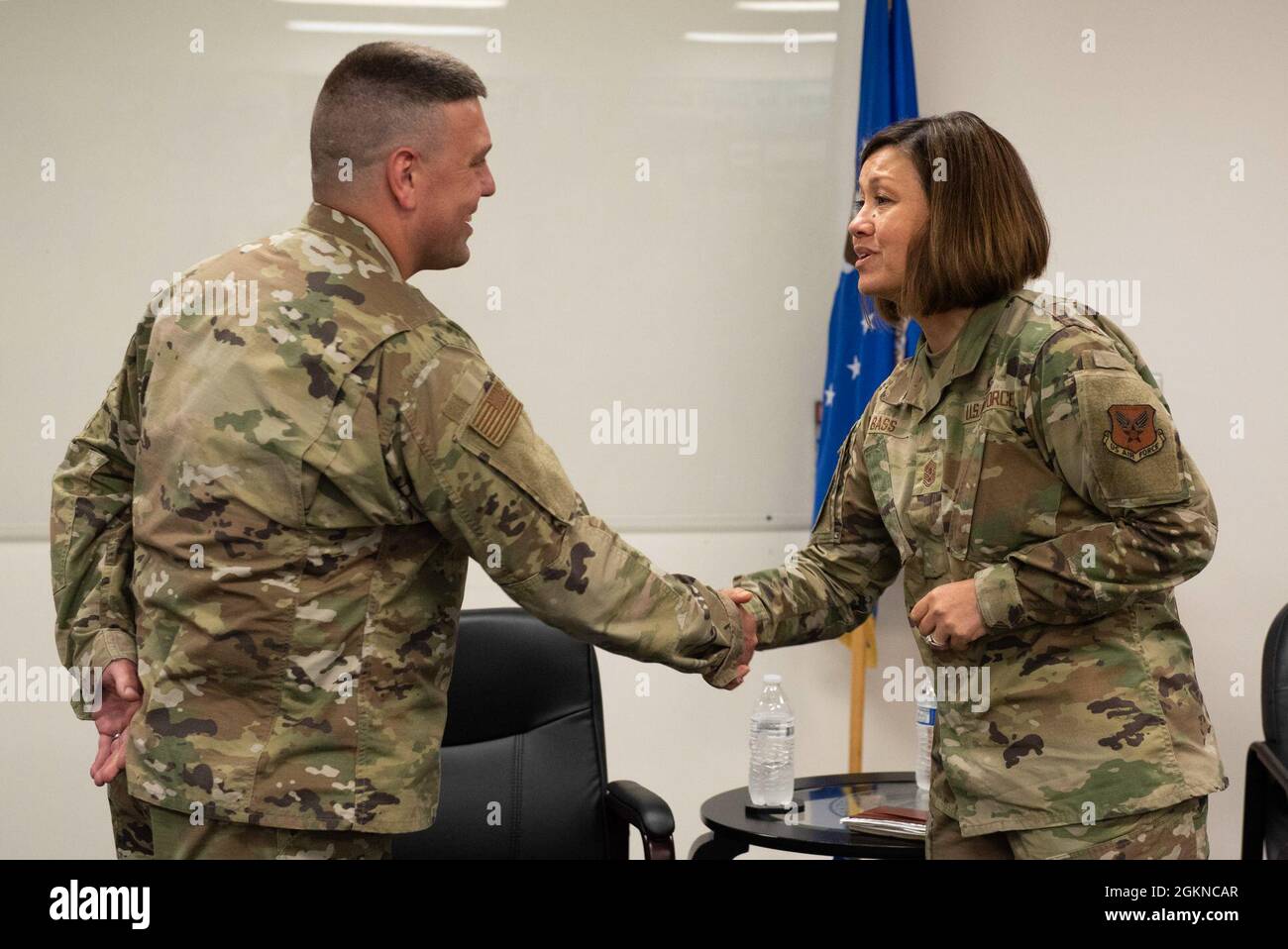 Chief Master Sergeant of the Air Force JoAnne S. Bass presents a coin ...
