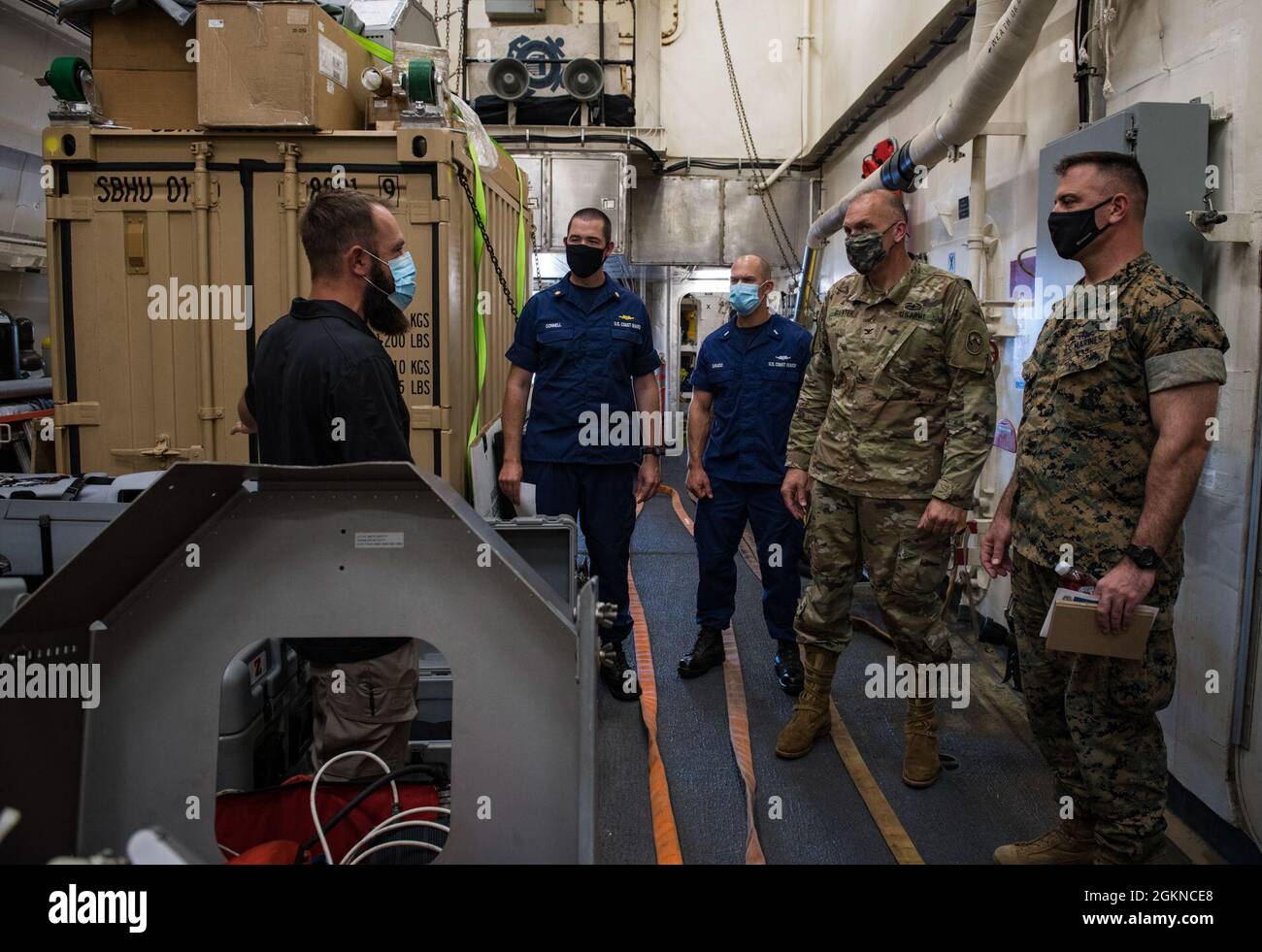 Jake Bunger, left, with Insitu, briefs U.S. Army Col. Steven Gventer ...