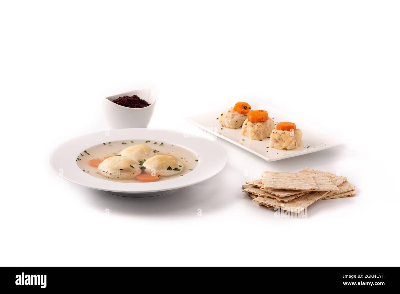 Traditional Jewish matzah ball soup, gefilte fish and matzah bread ...