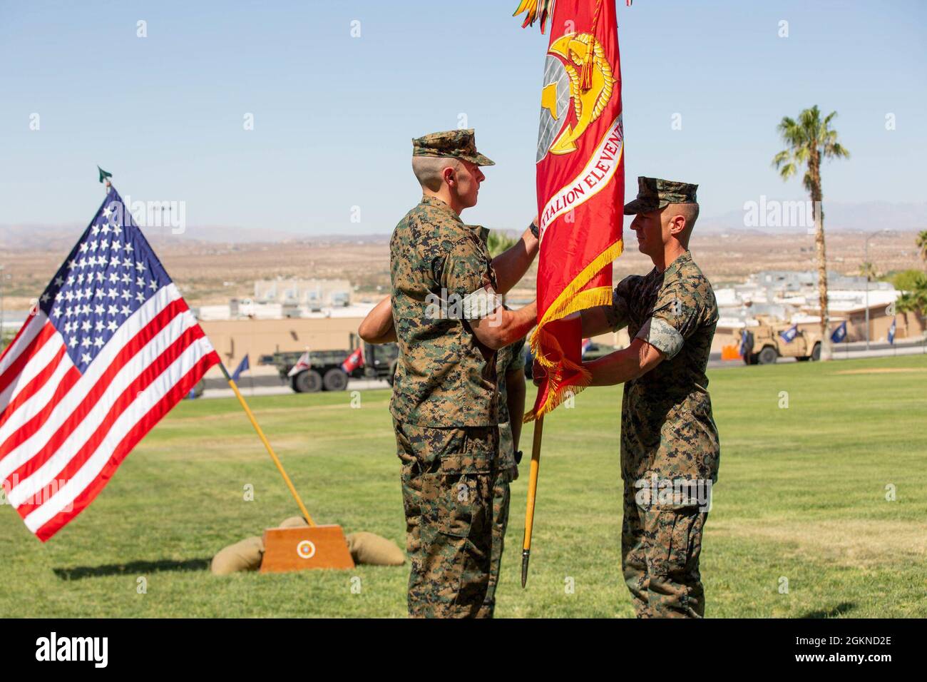 U.S. Marine Corps Lt. Col. Peter F. Priester (right), the outgoing ...