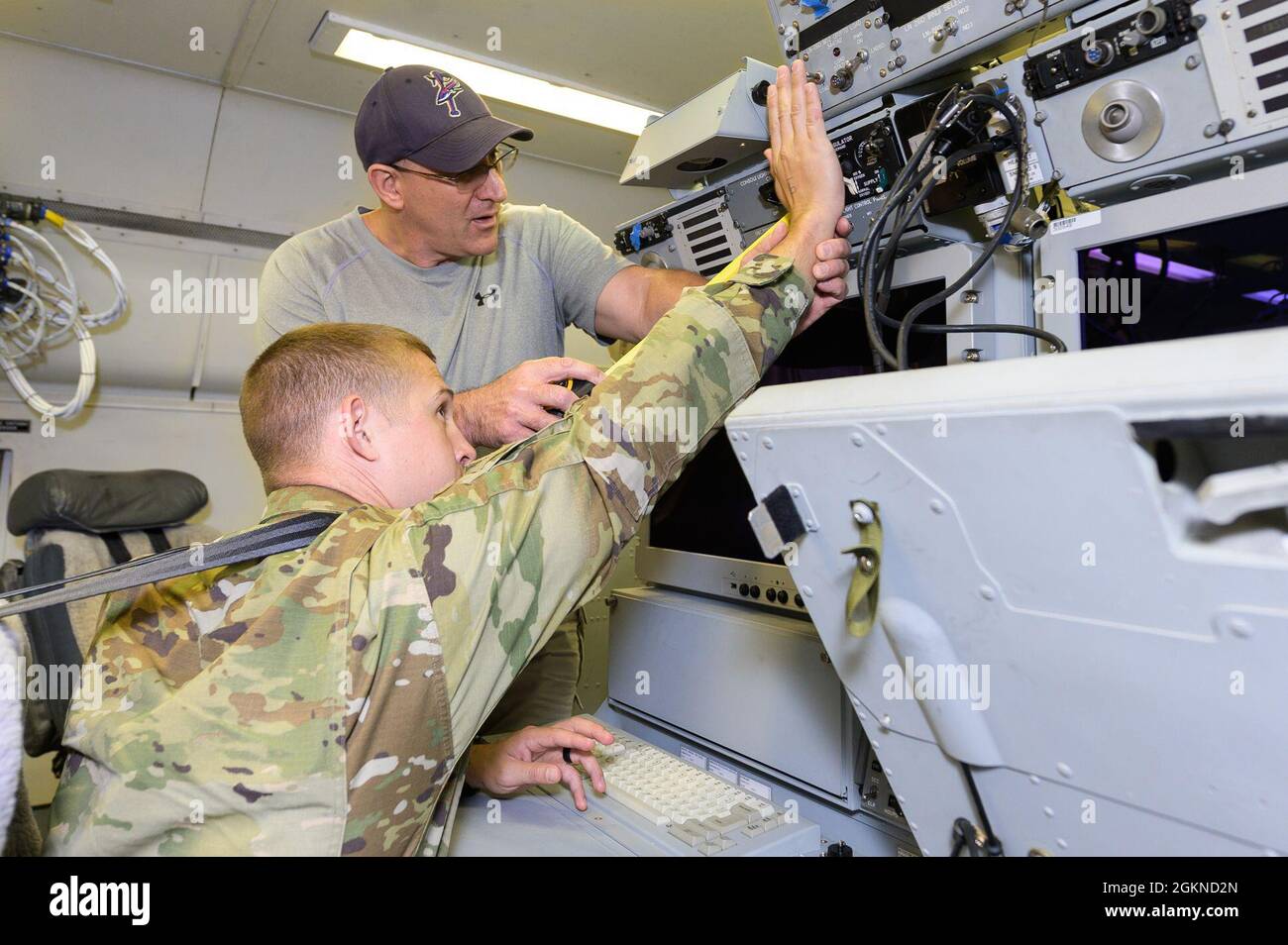 Brian Ostermann, an anthropometric study contractor, measures the reach ...
