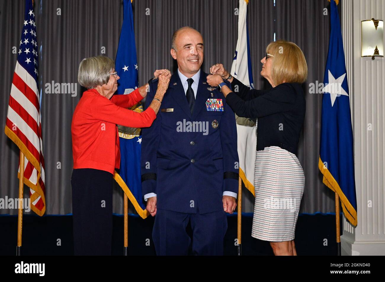 Lt. Gen. Robert Miller has his new rank pinned on by his wife and ...