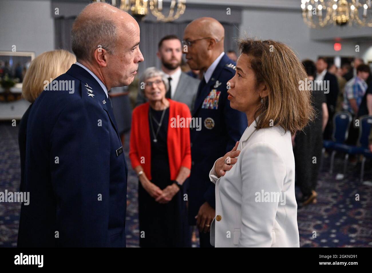 Lt. Gen. Robert Miller speaks with Sharene Brown, the wife of Air Force ...