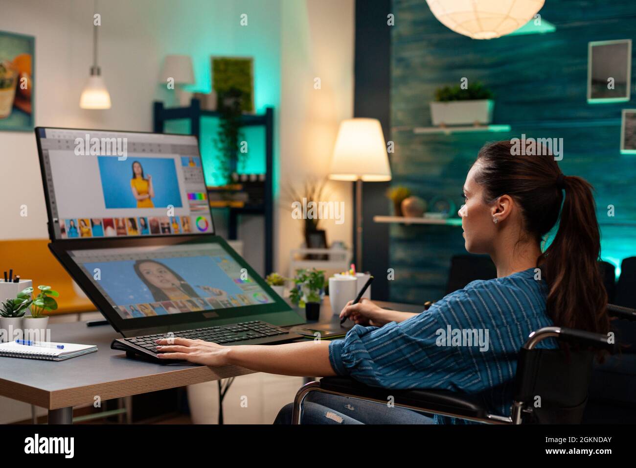 Photography production artist doing retouch work at office studio using ...