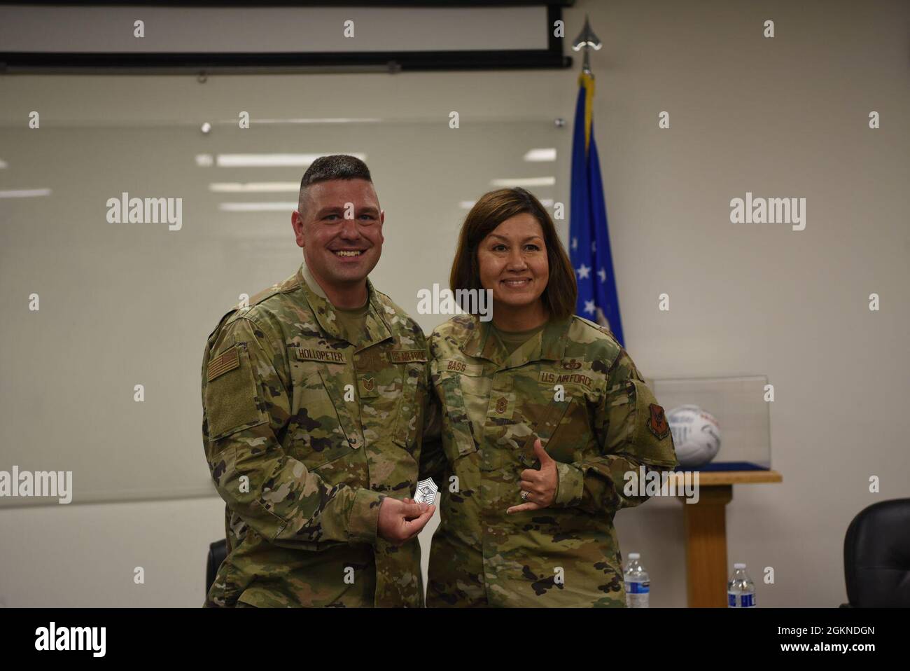 Chief Master Sergeant of the Air Force JoAnne S. Bass presents a coin ...