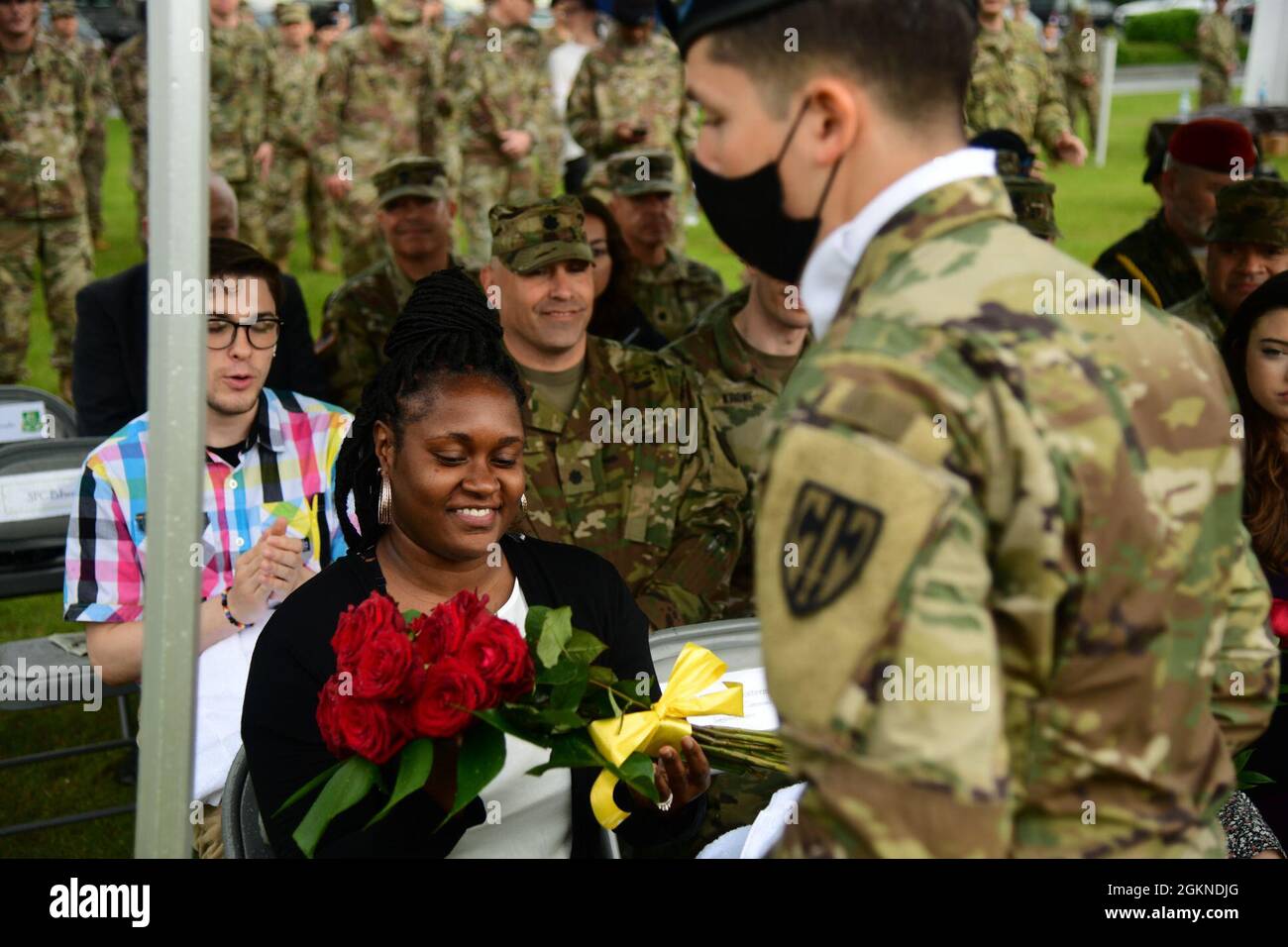 Distinguished guests receive flowers during the 18th Military Police ...