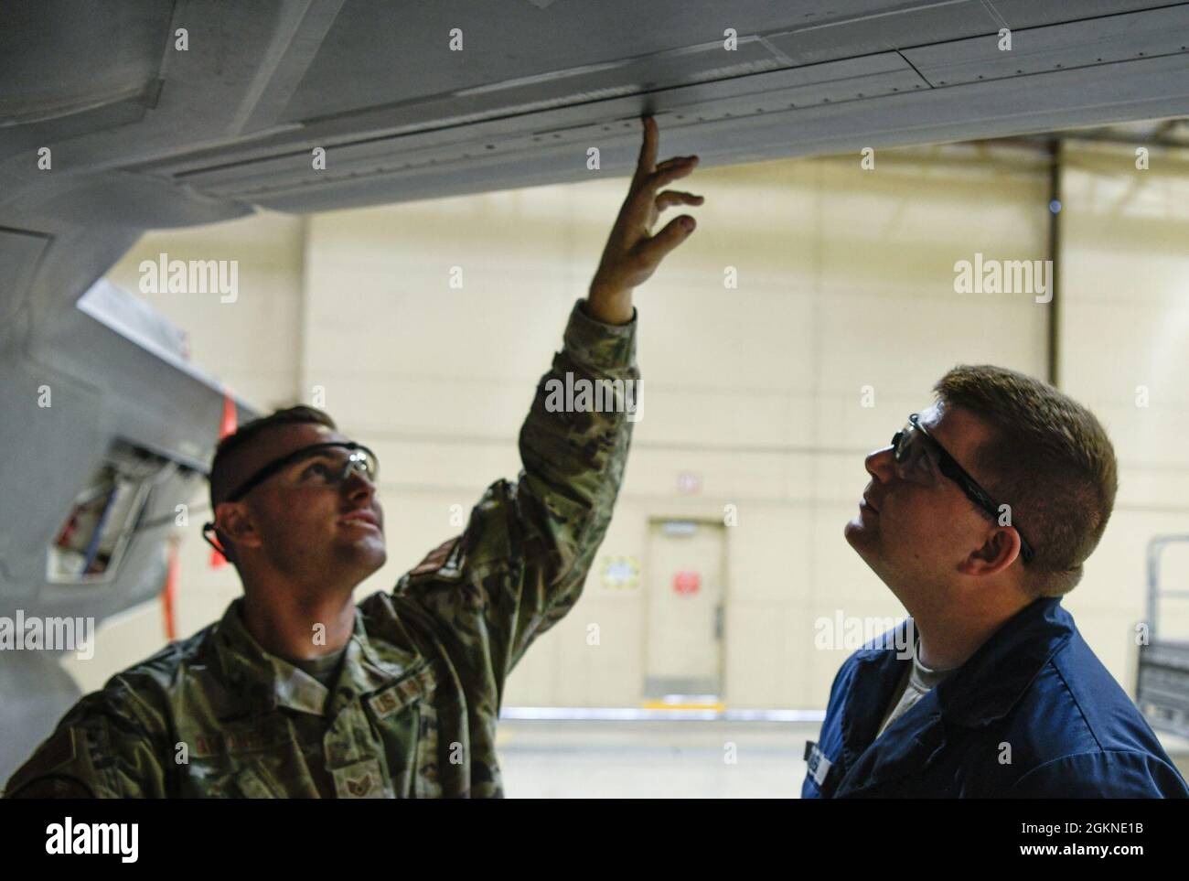 Staff Sgt. Robert Briones, 62nd Aircraft Maintenance Unit crew chief, and Airman 1st Class Todd ...