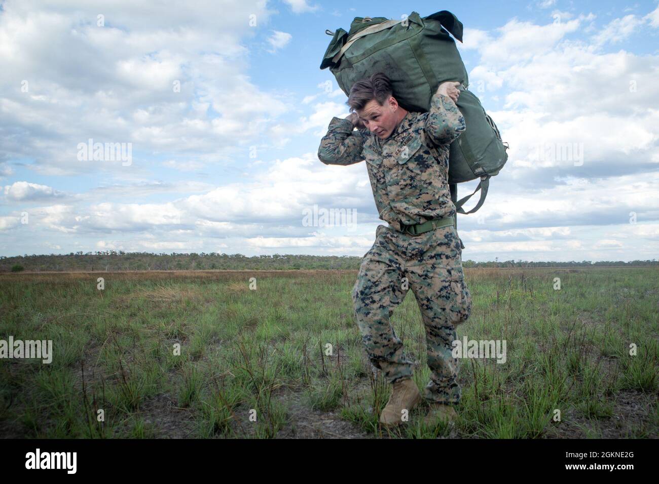 U.S. Marine Corps Sgt. Christian Rutledge, left, a parachute rigger ...