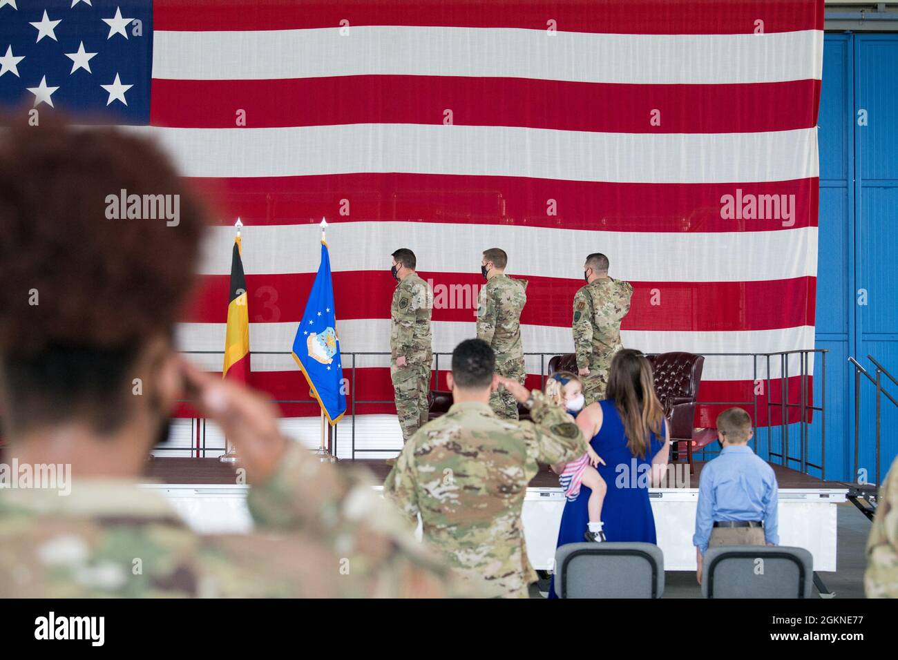 U.S. Airmen, families and guests render honors during the 424th Air ...