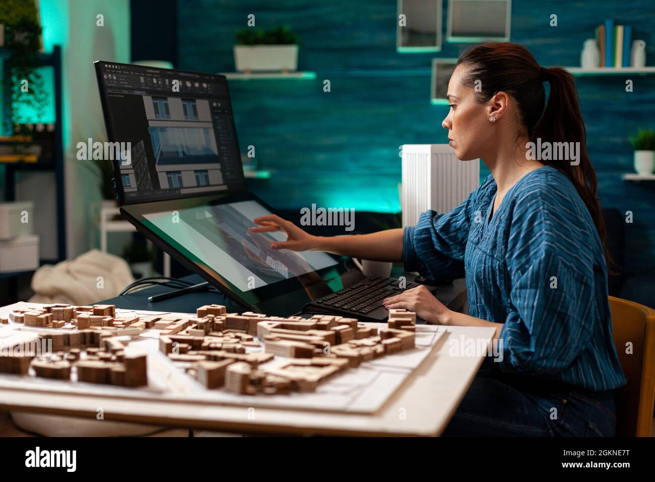 Architectural sketch designer making digital building plan for ...