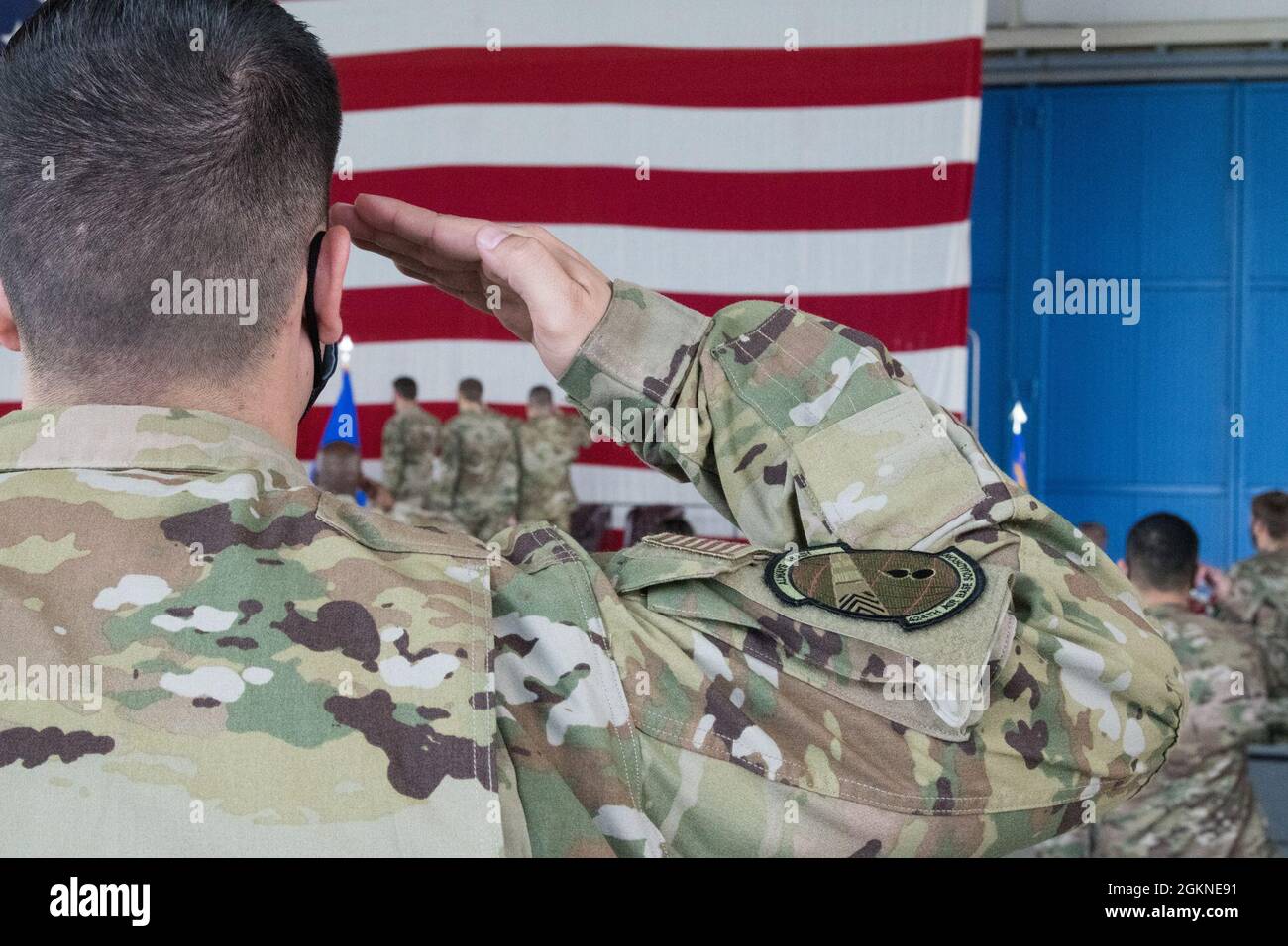 U.S. Airmen, families and guests render honors during the 424th Air ...