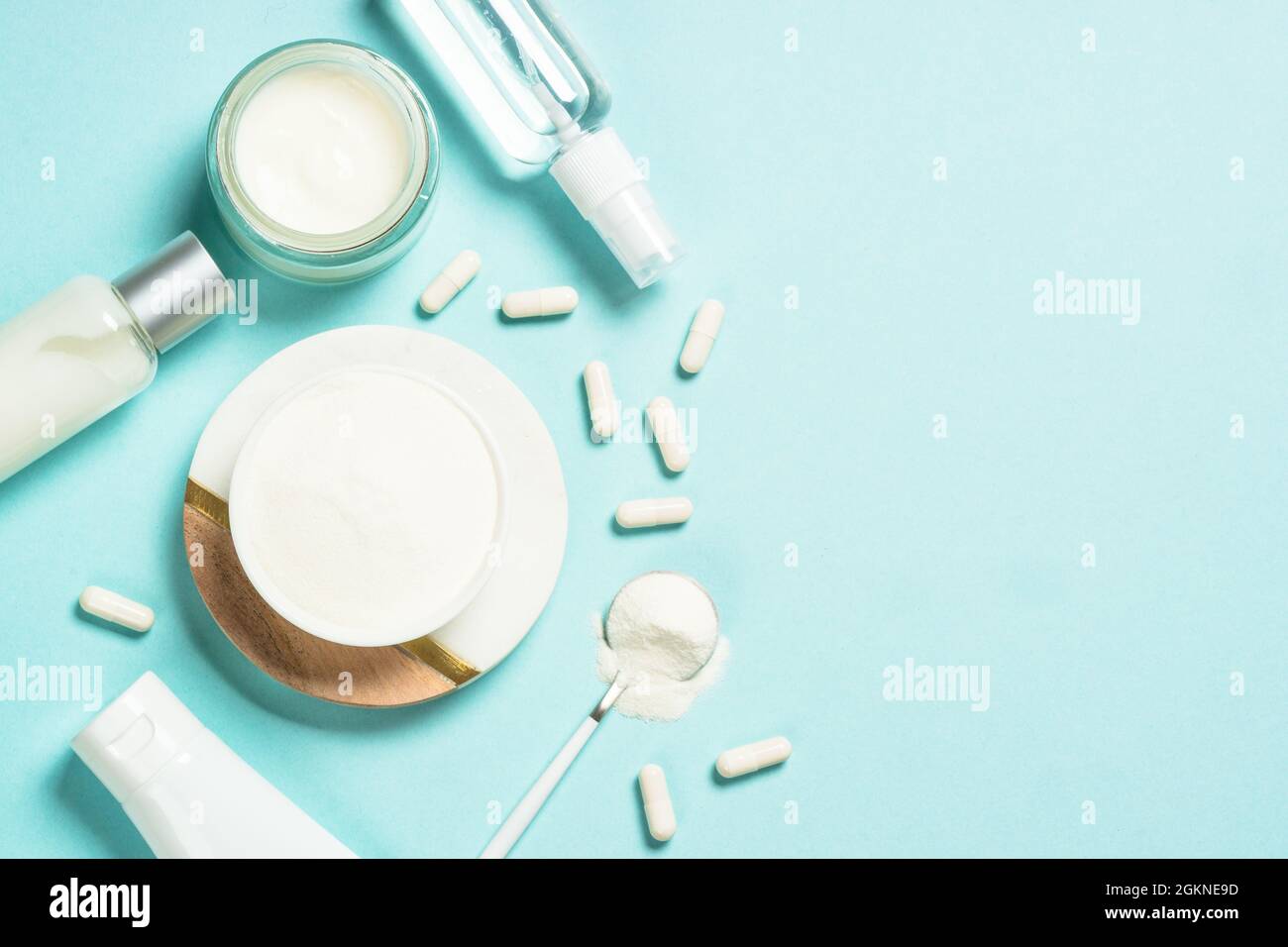 Collagen powder dietary supplement at blue background Stock Photo - Alamy