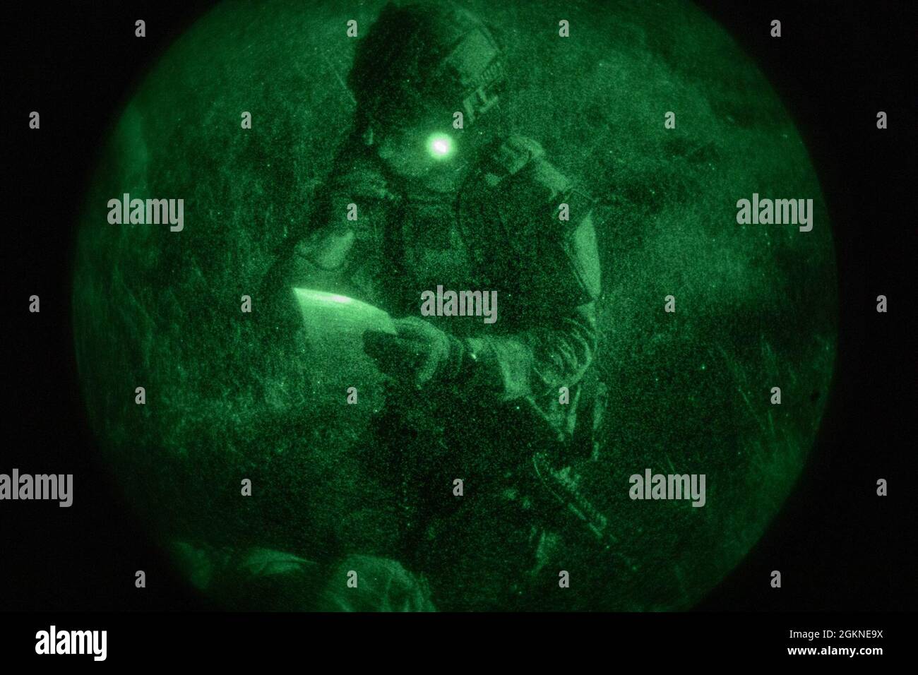 A Greek Special Operations Forces operator delivers a situation report ...