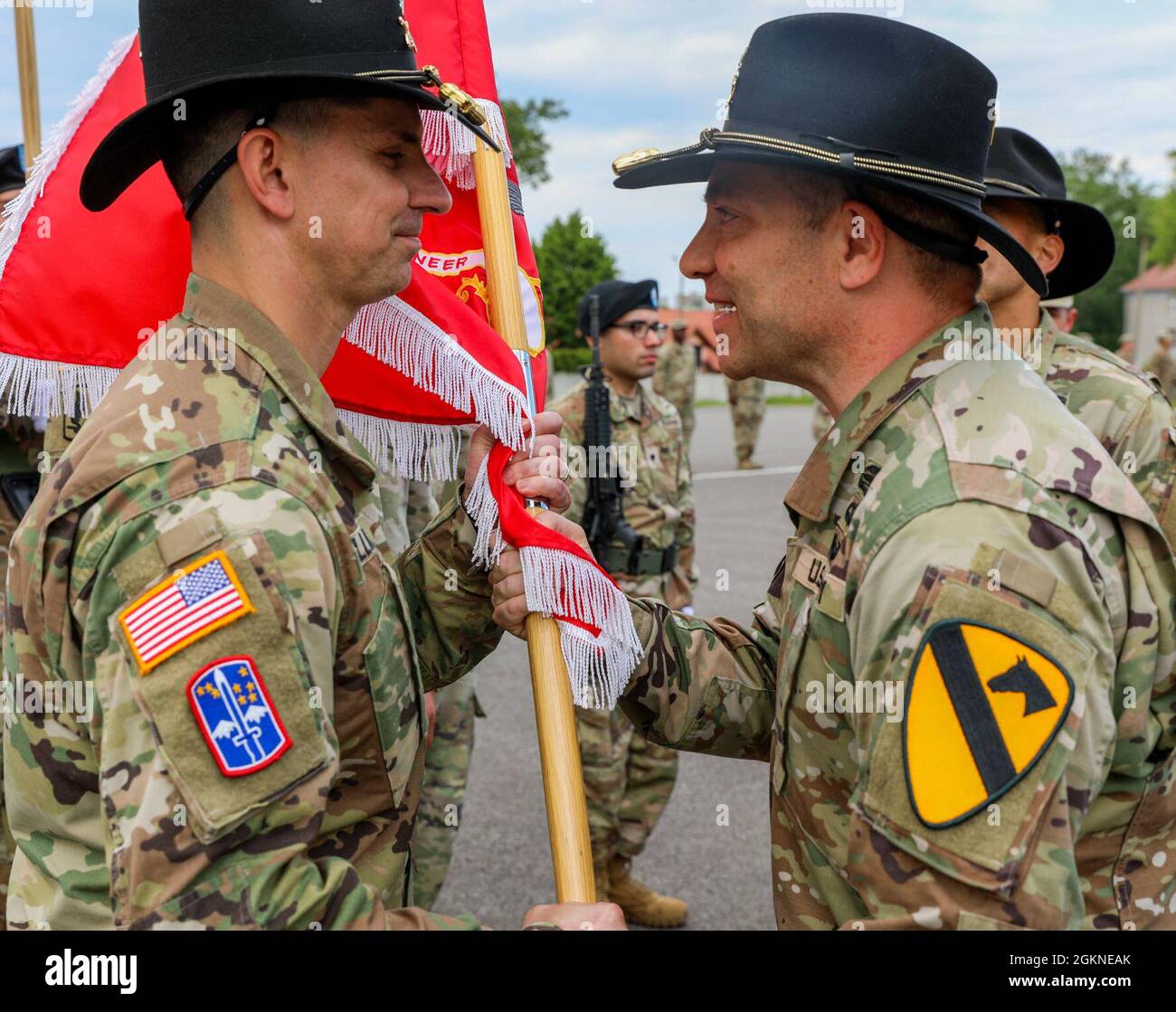 Col. Jon W. Meredith, commander, 1st Armored Brigade Combat Team, hands ...
