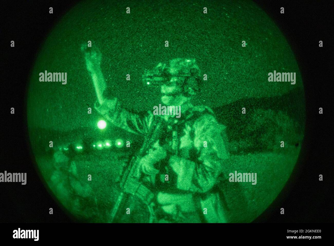 A Greek Special Operations Forces operator conducts a nighttime patrol ...