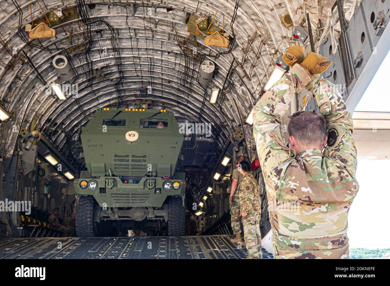U.S. Airmen with the 105th Airlift Wing, New York National Guard, load ...