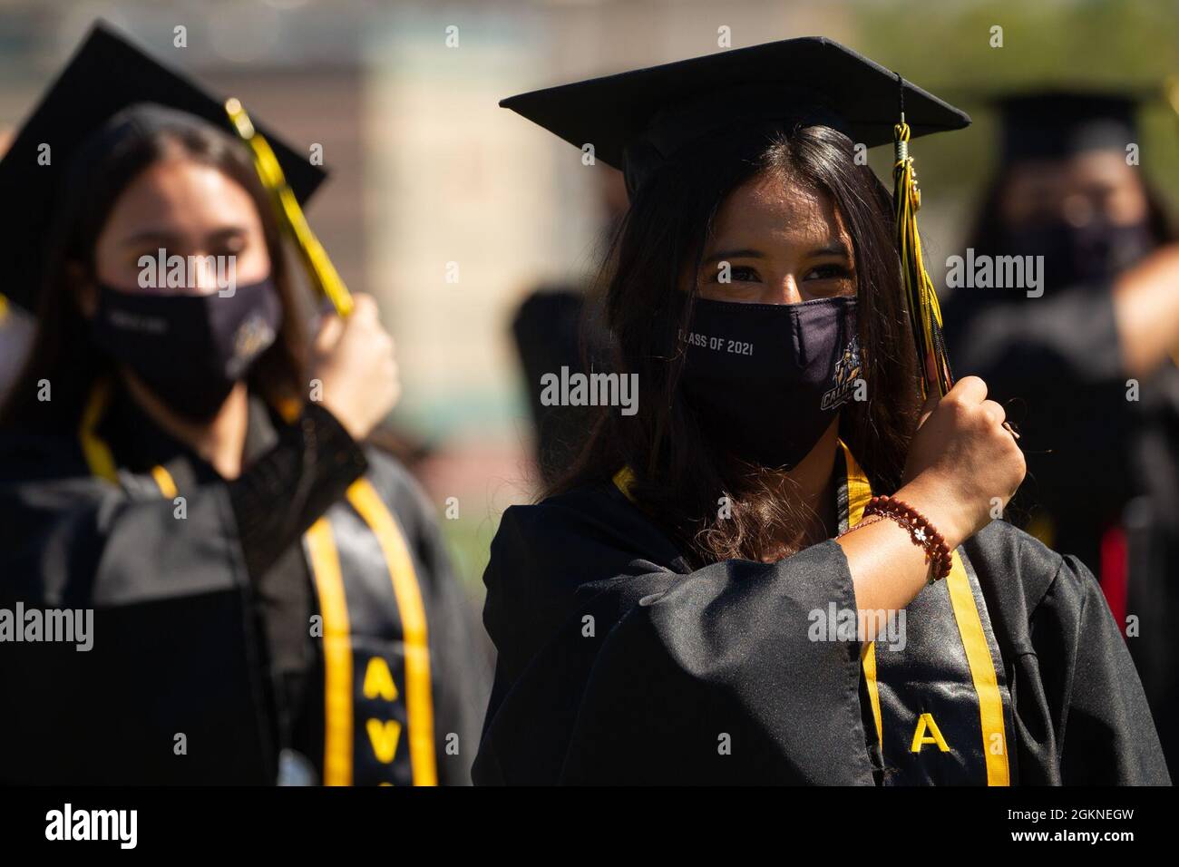 California Military Institute graduates move their tassels from right ...